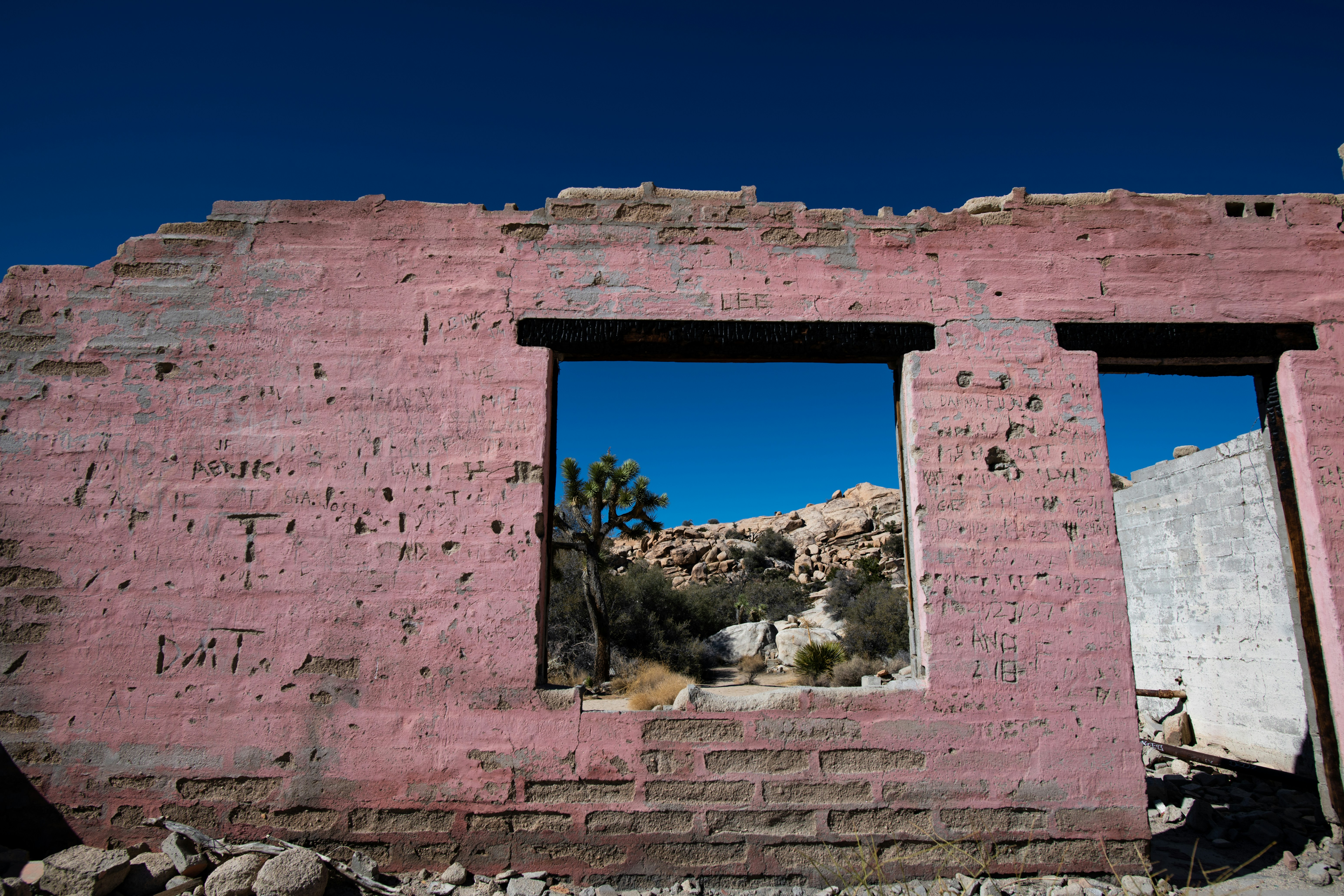 Windowed Desert Vista Through a Pink Brick Ruin