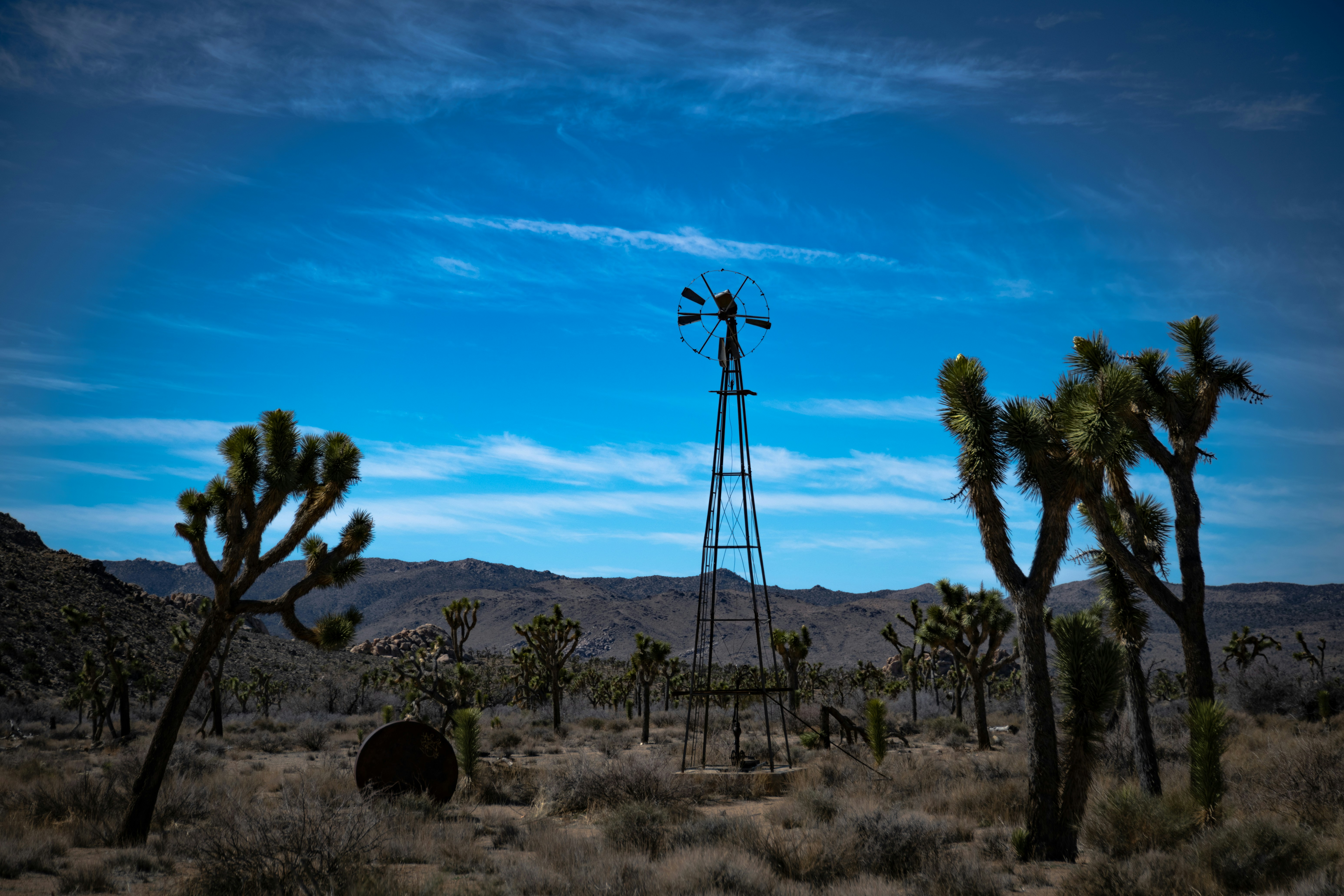Desert Windmill Silence under a Wide Blue Sky
