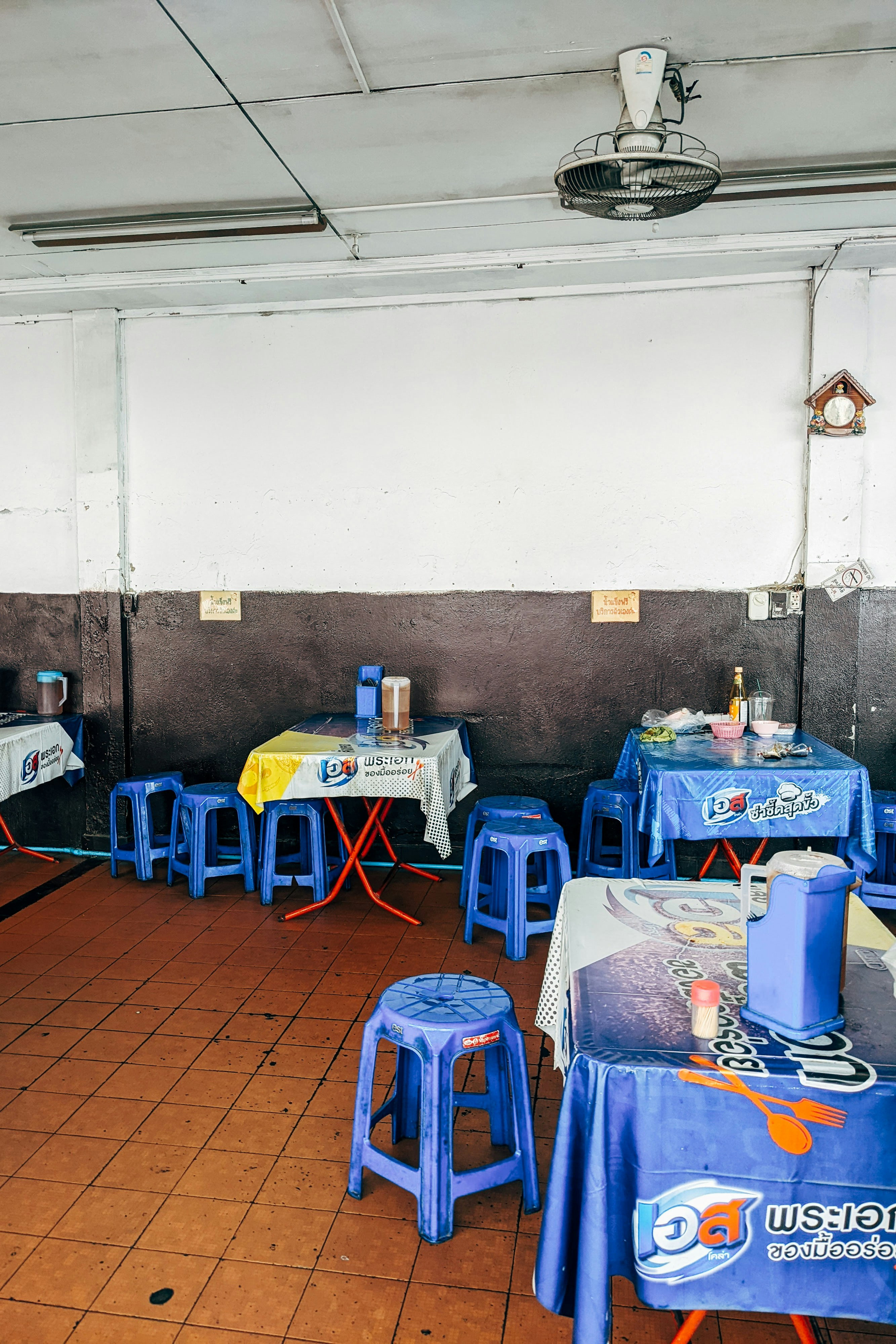 A restaurant with blue tables and blue stools photo – Free Bangkok ...