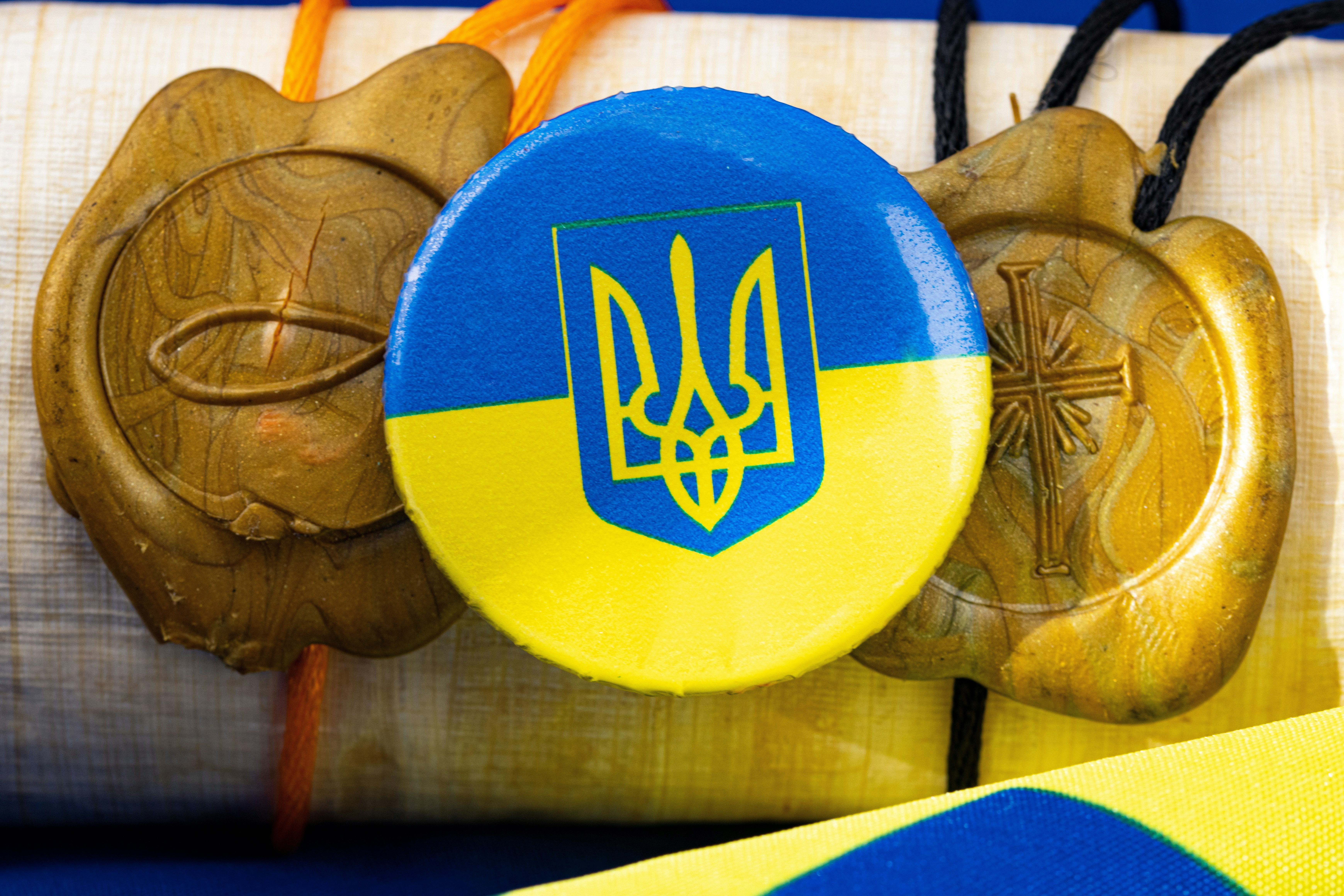 Trident Crest Between Brass Seals: A Close-Up of Ukrainian Emblems