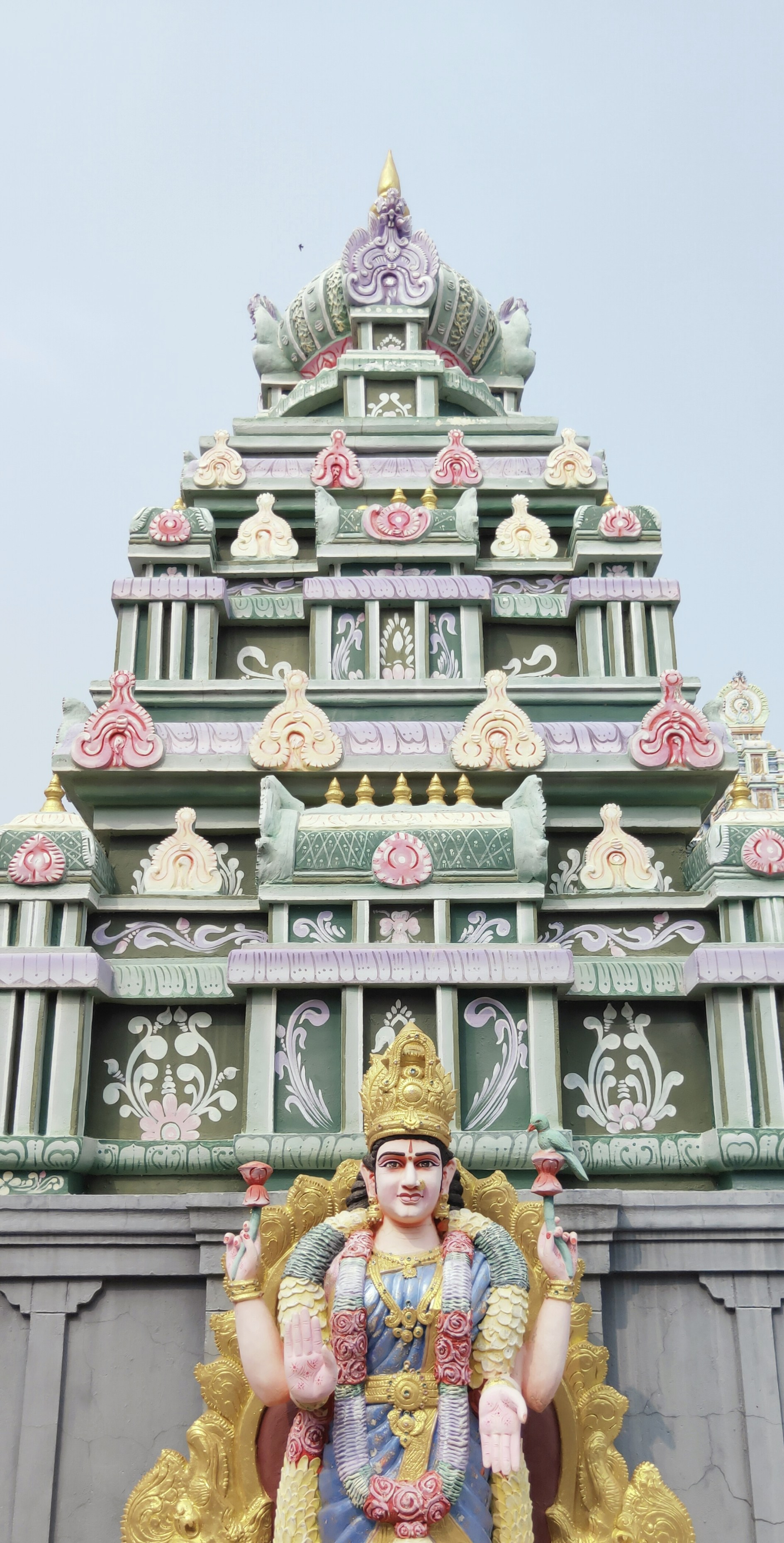 A statue of a god in front of a building photo – Free Grey Image on ...