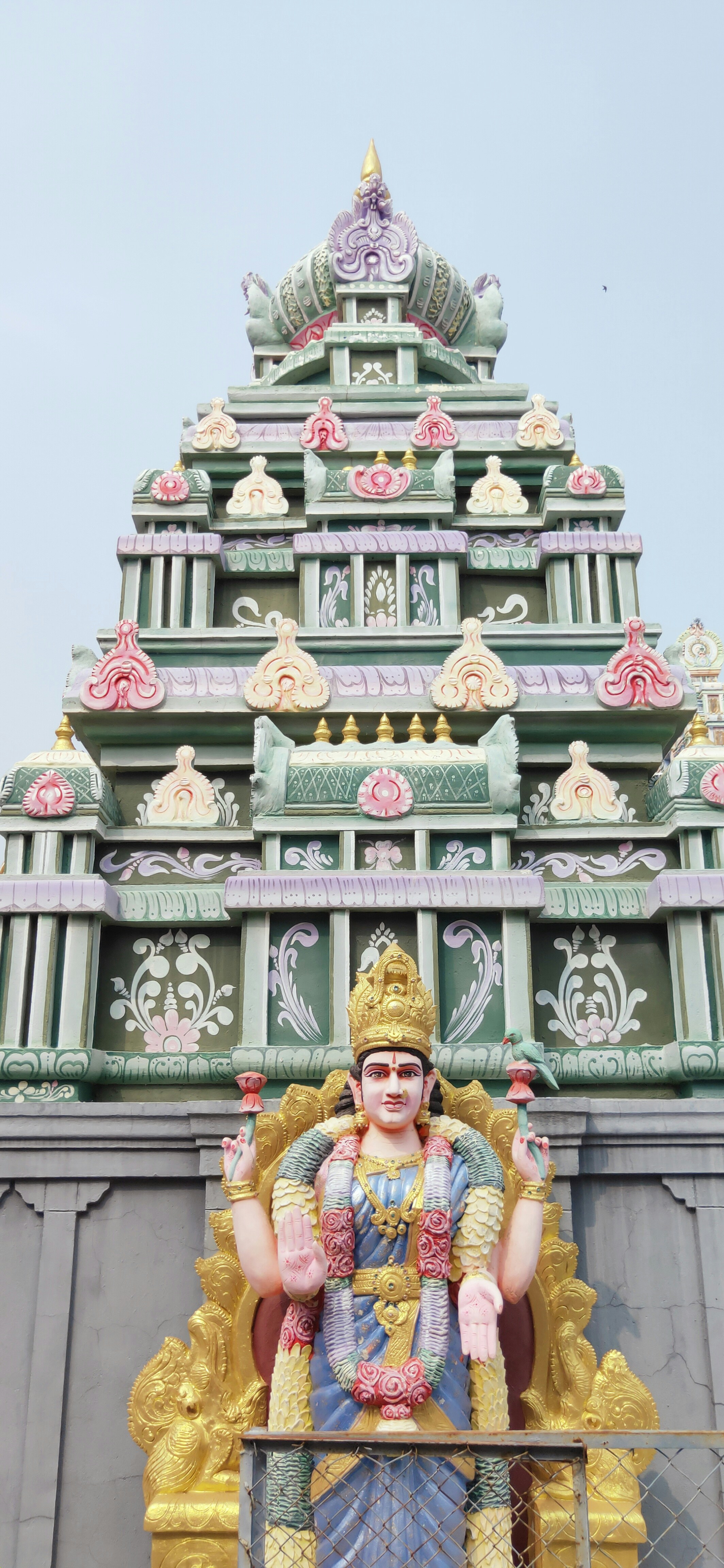 A statue of a god in front of a building photo – Free India Image on ...