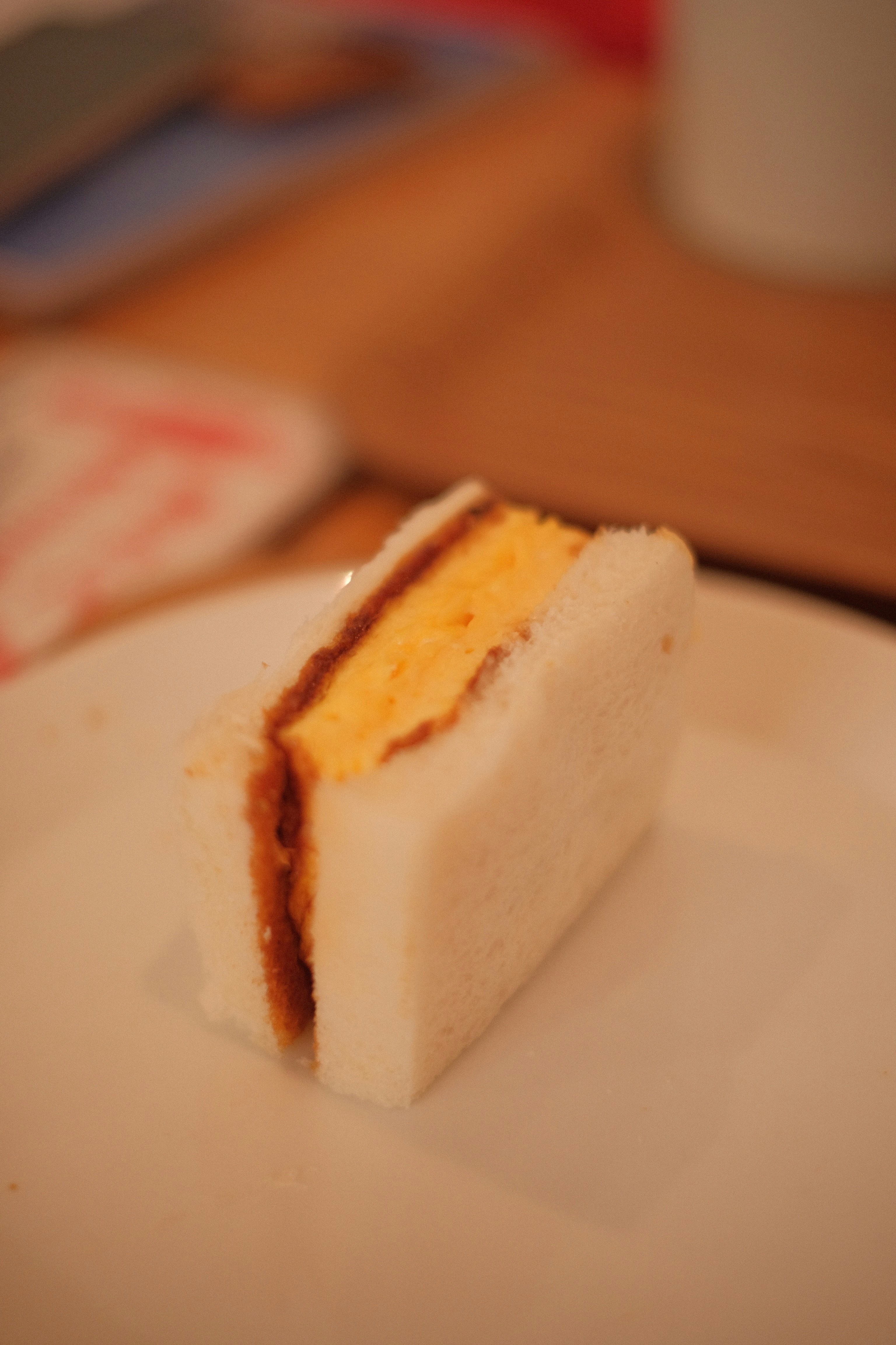 Triple-Layer White Slice: A Soft-Focused Snippet of Dessert-Style Cake Sandwich