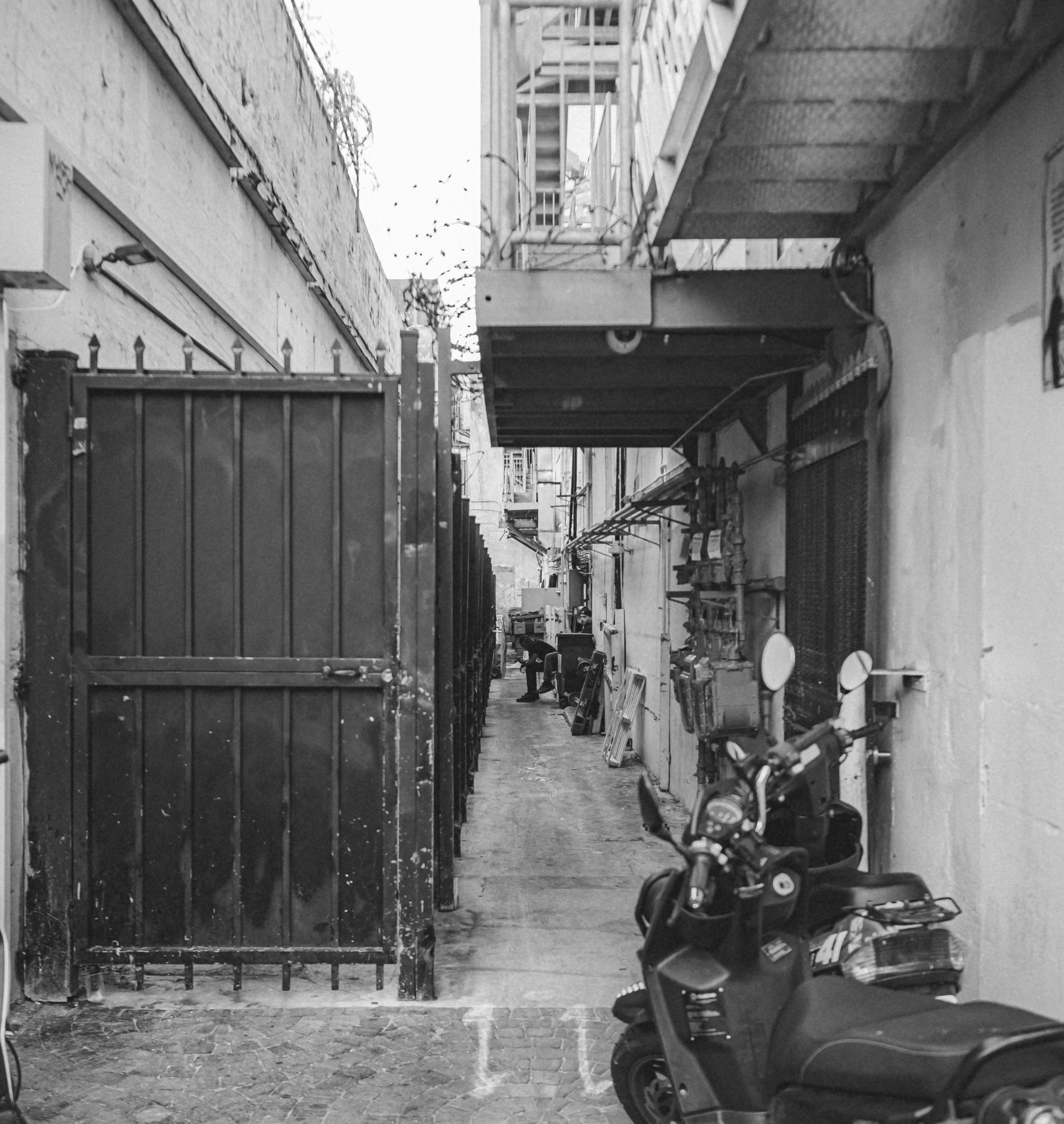 A black and white photo of a narrow alleyway photo – Free Grey Image on ...