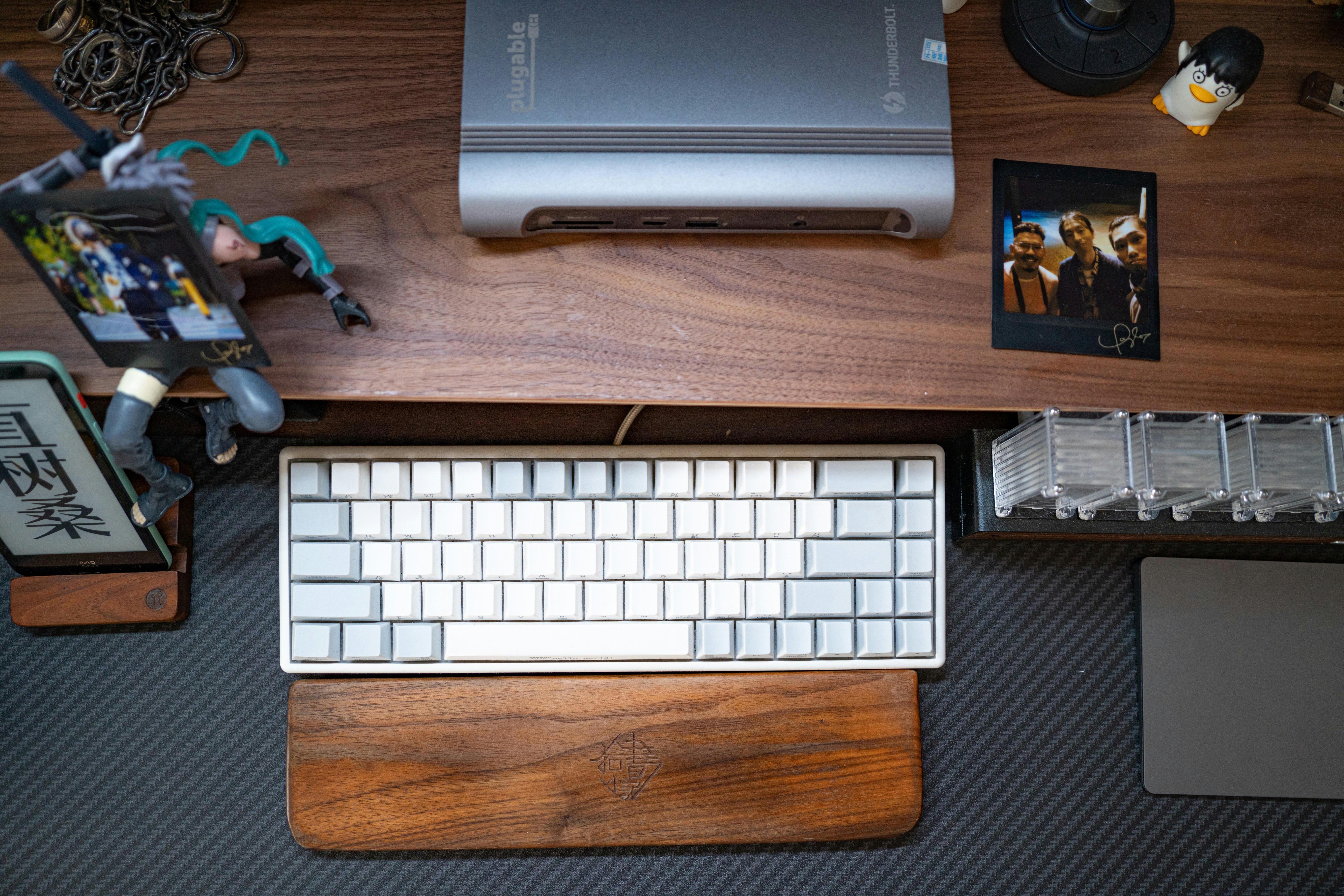 A computer keyboard sitting on top of a wooden desk photo – Free ...