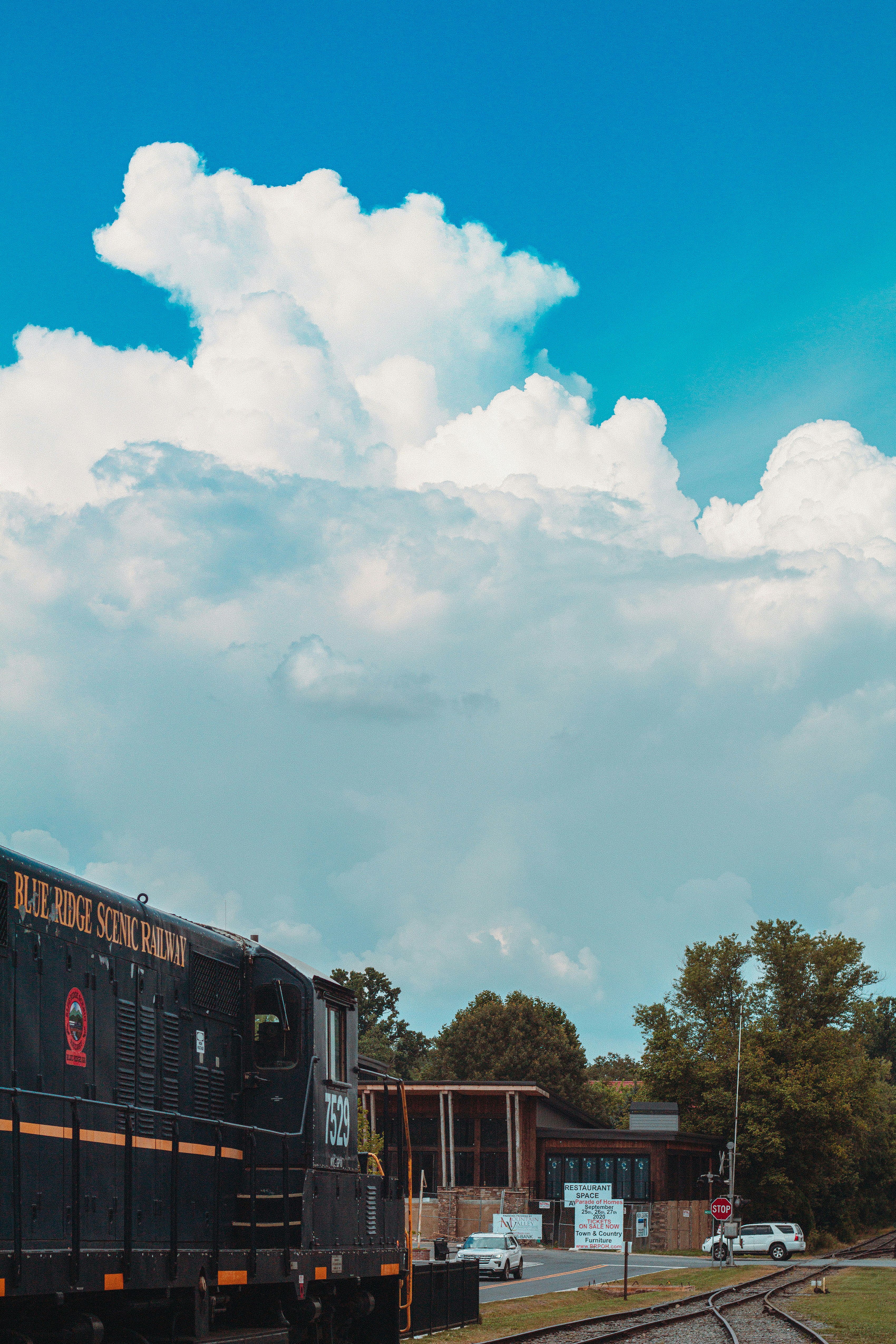 Locomotive on a Quiet Blue Ridge Line Under a Wide Sky