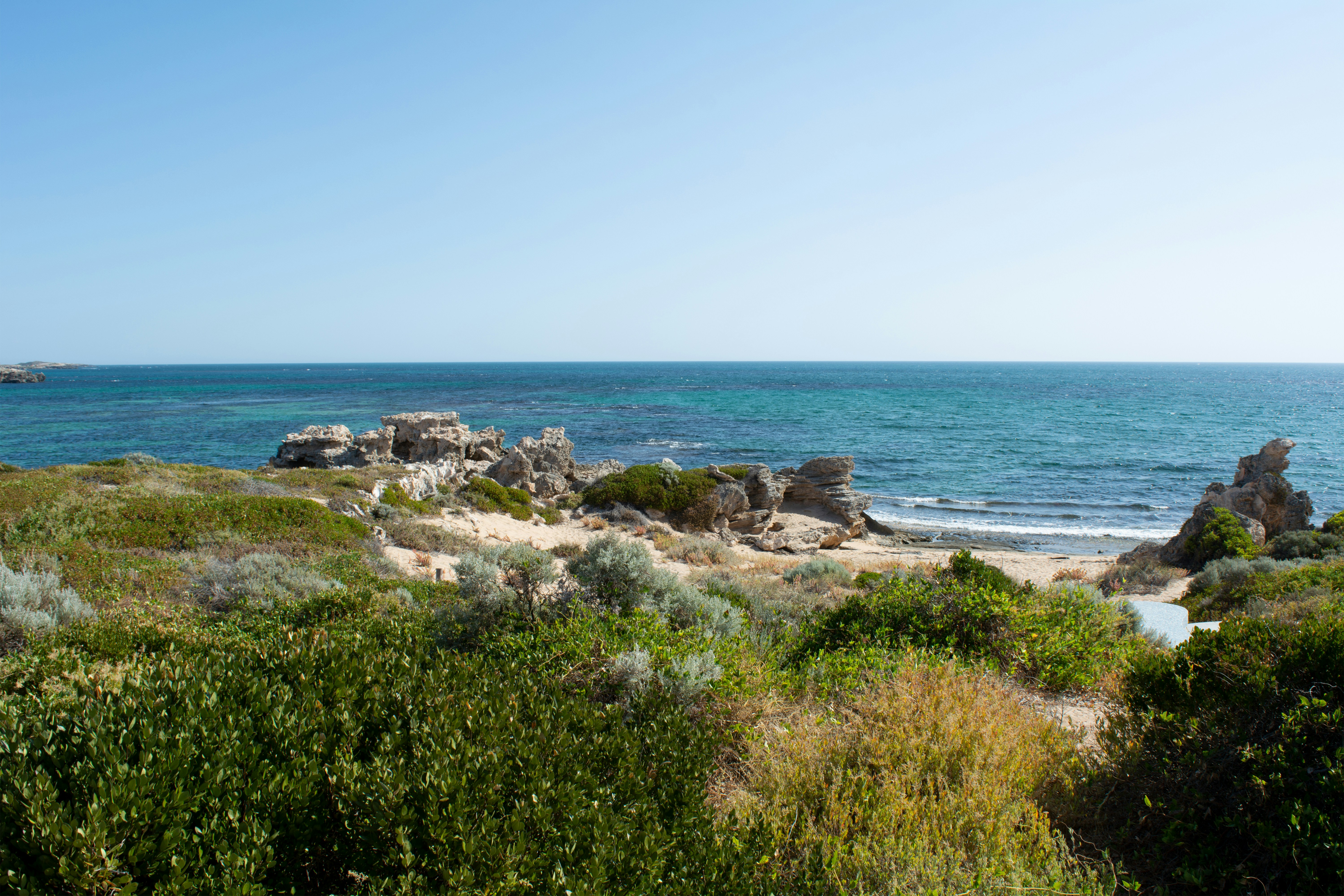 A view of the ocean from a rocky shore photo – Free Point peron road ...