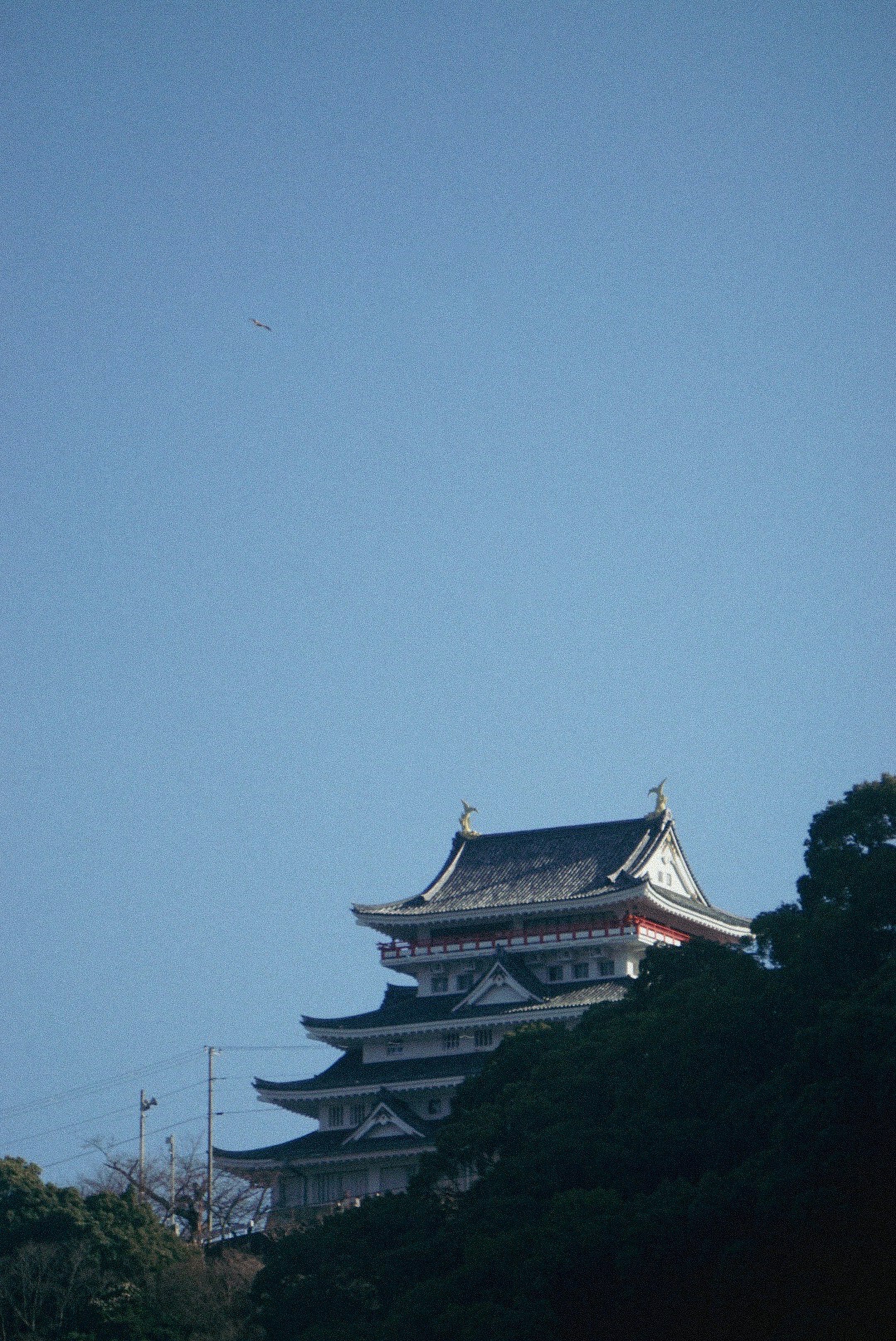 Azure Sky Over a Hilltop Pagoda: A Quiet Moment of Architecture