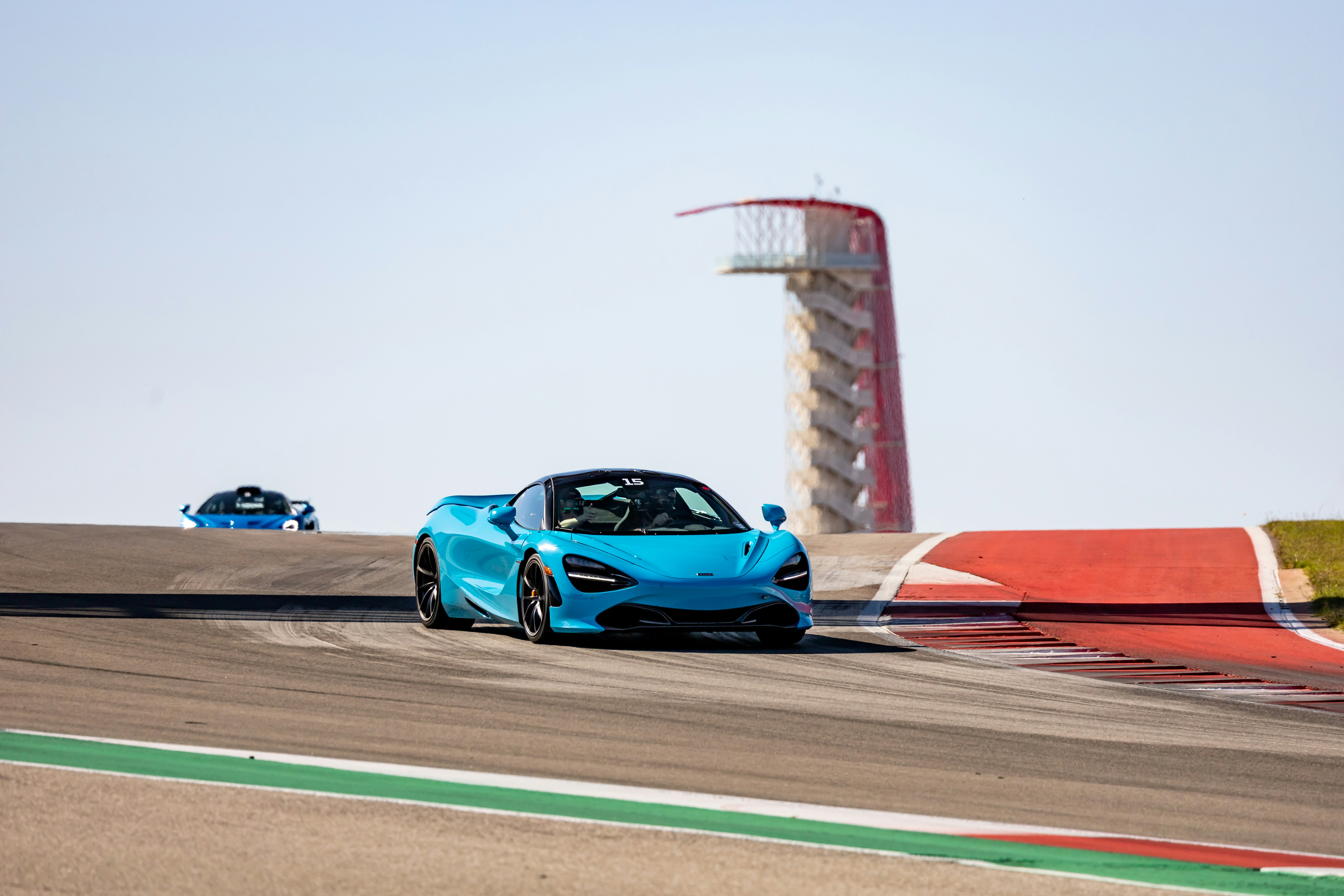 A blue sports car driving on a race track photo – Free Transportation ...