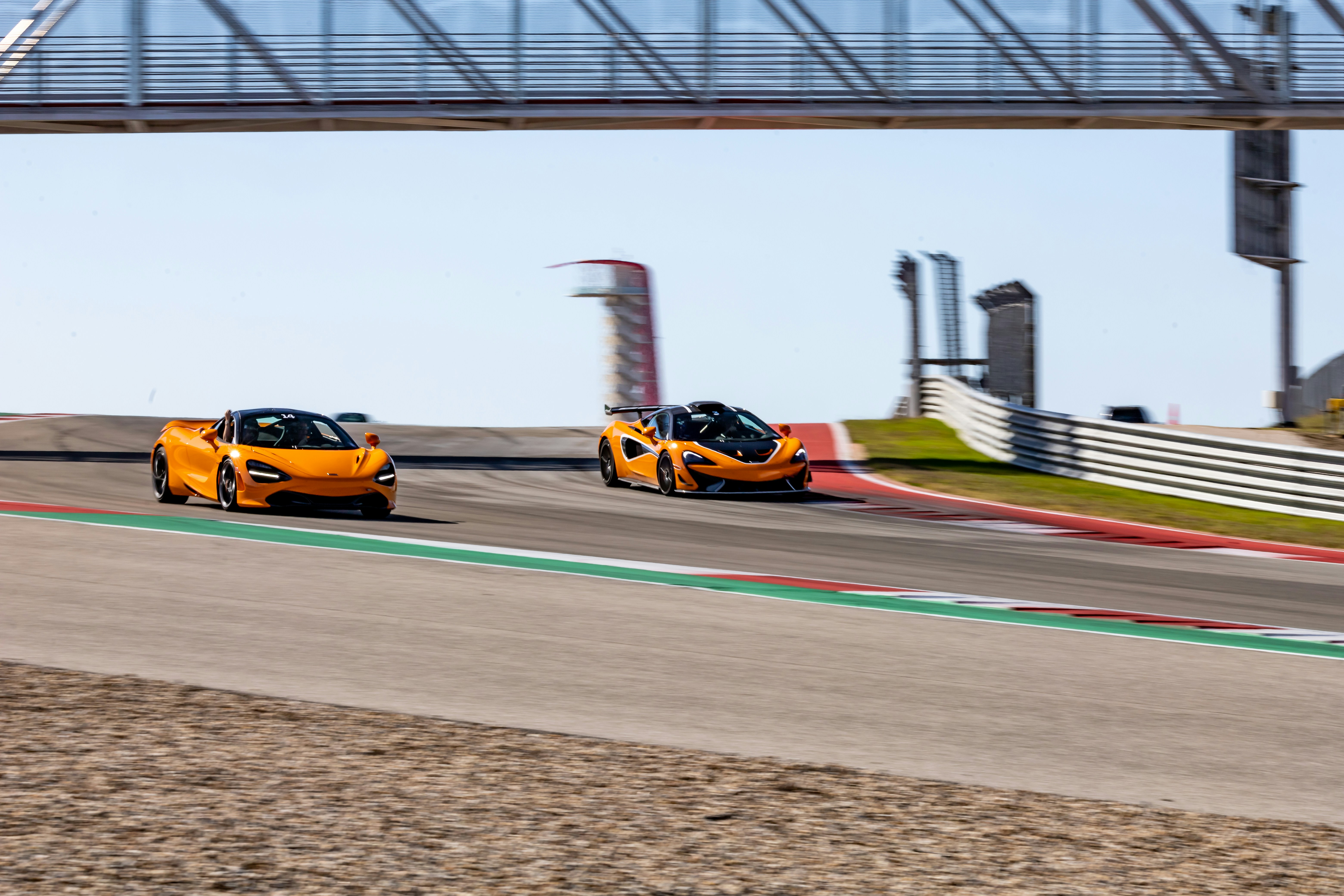 Two orange sports cars driving on a race track photo – Free Car Image ...