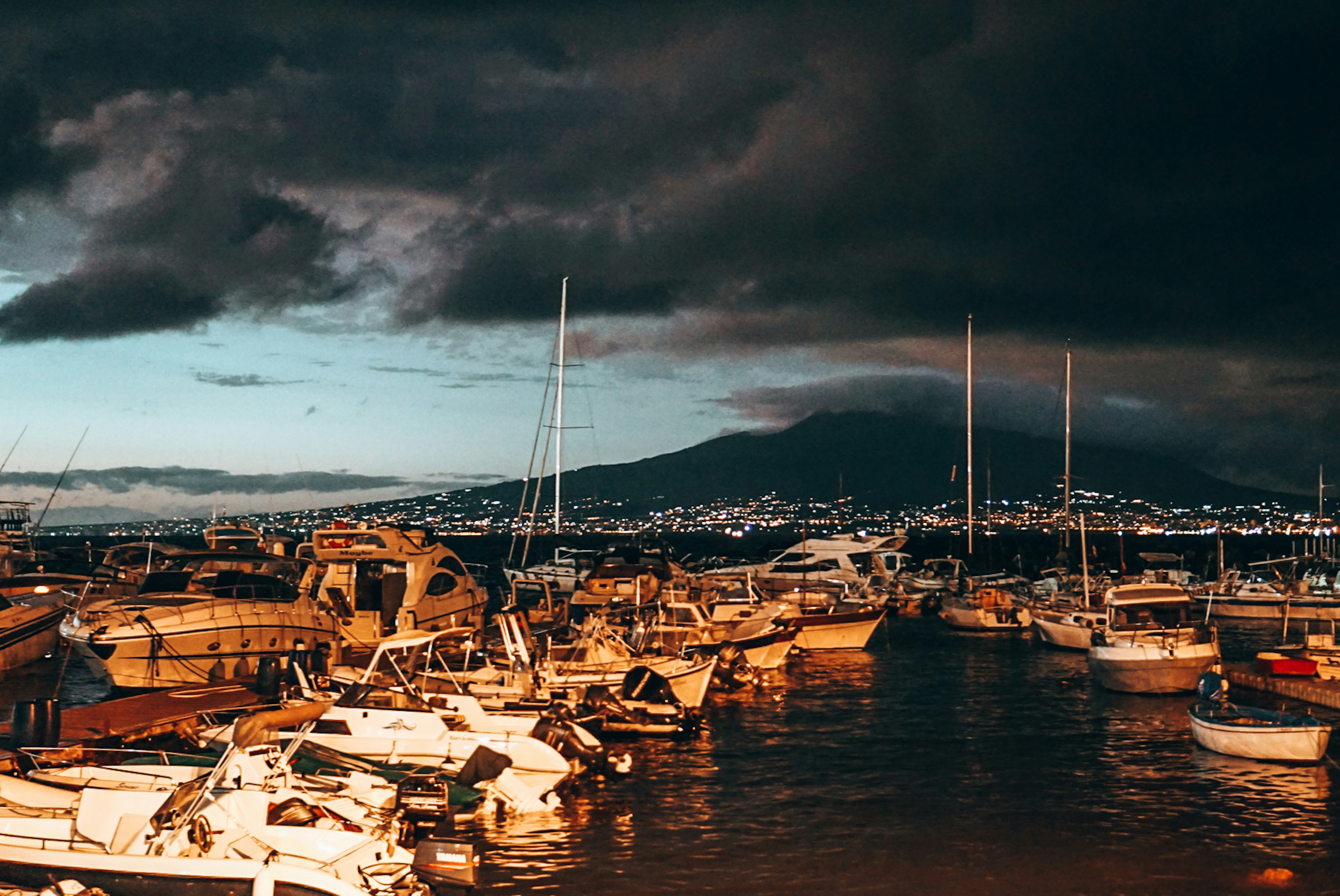 Amber Marina at Dusk: Boats Rest in Quiet Reflections