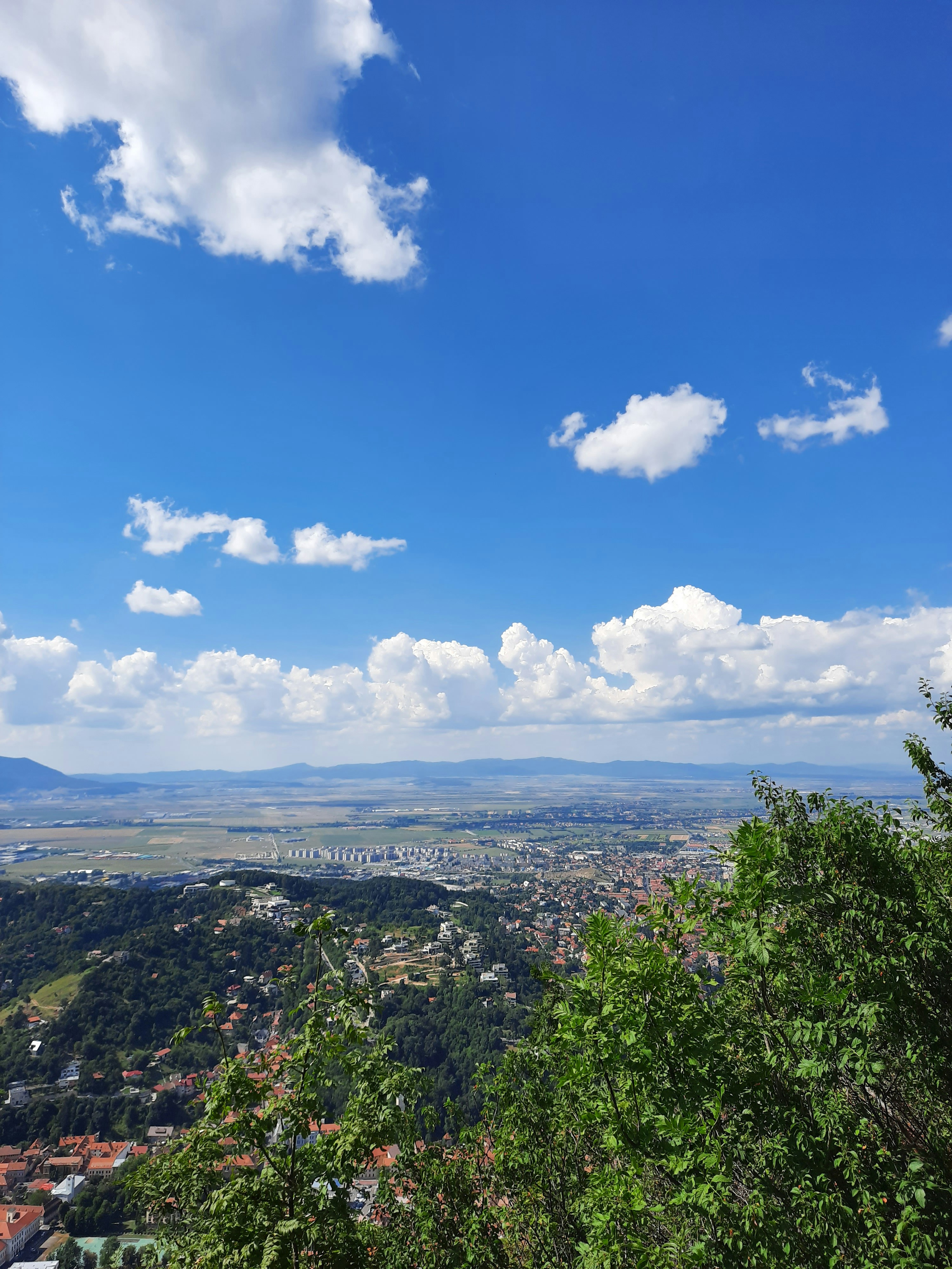 A view of a city from a hill photo – Free Blue Image on Unsplash