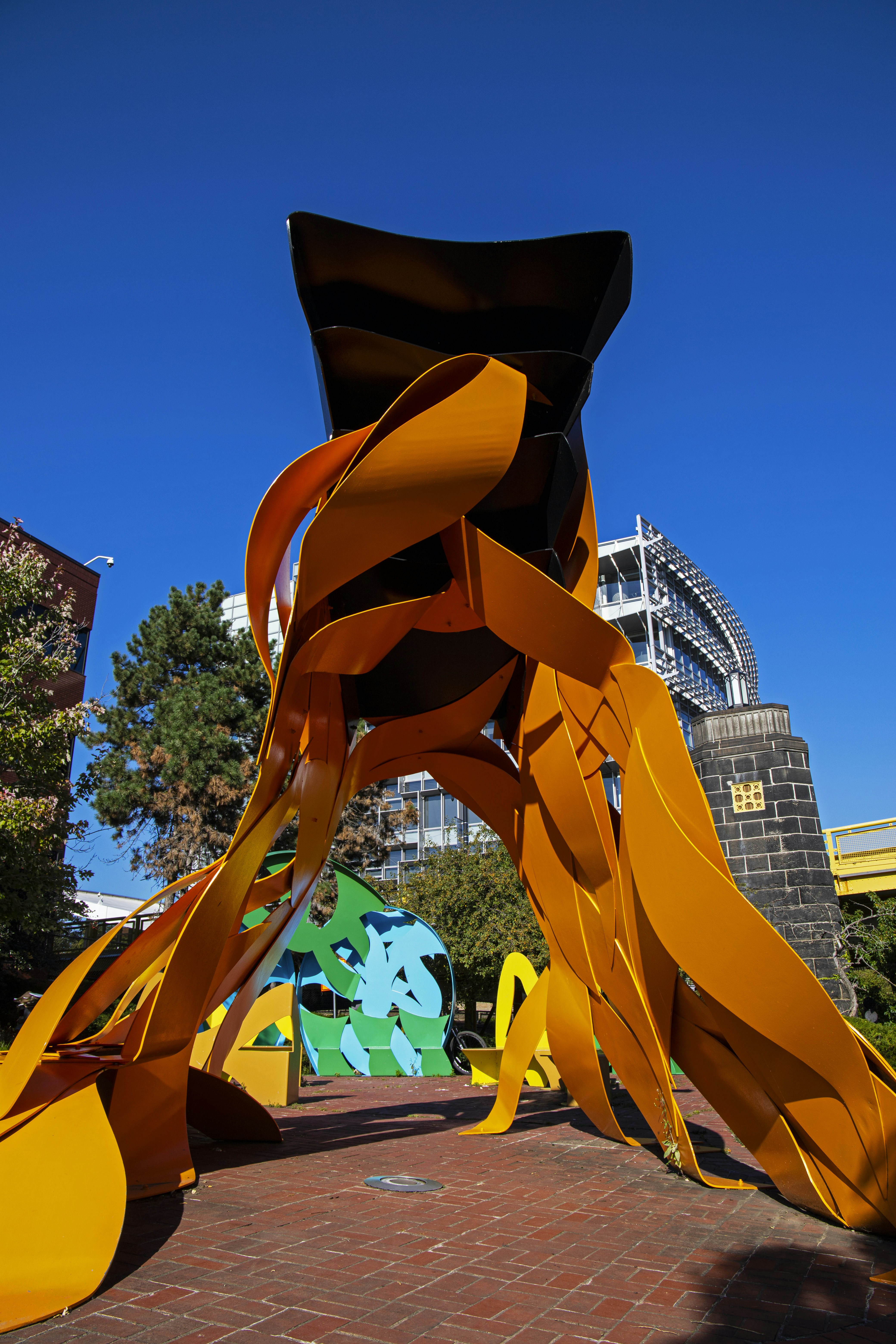 Inferno Ribbons in Blue: An Abstract Metal Sculpture Reaching for the Sky
