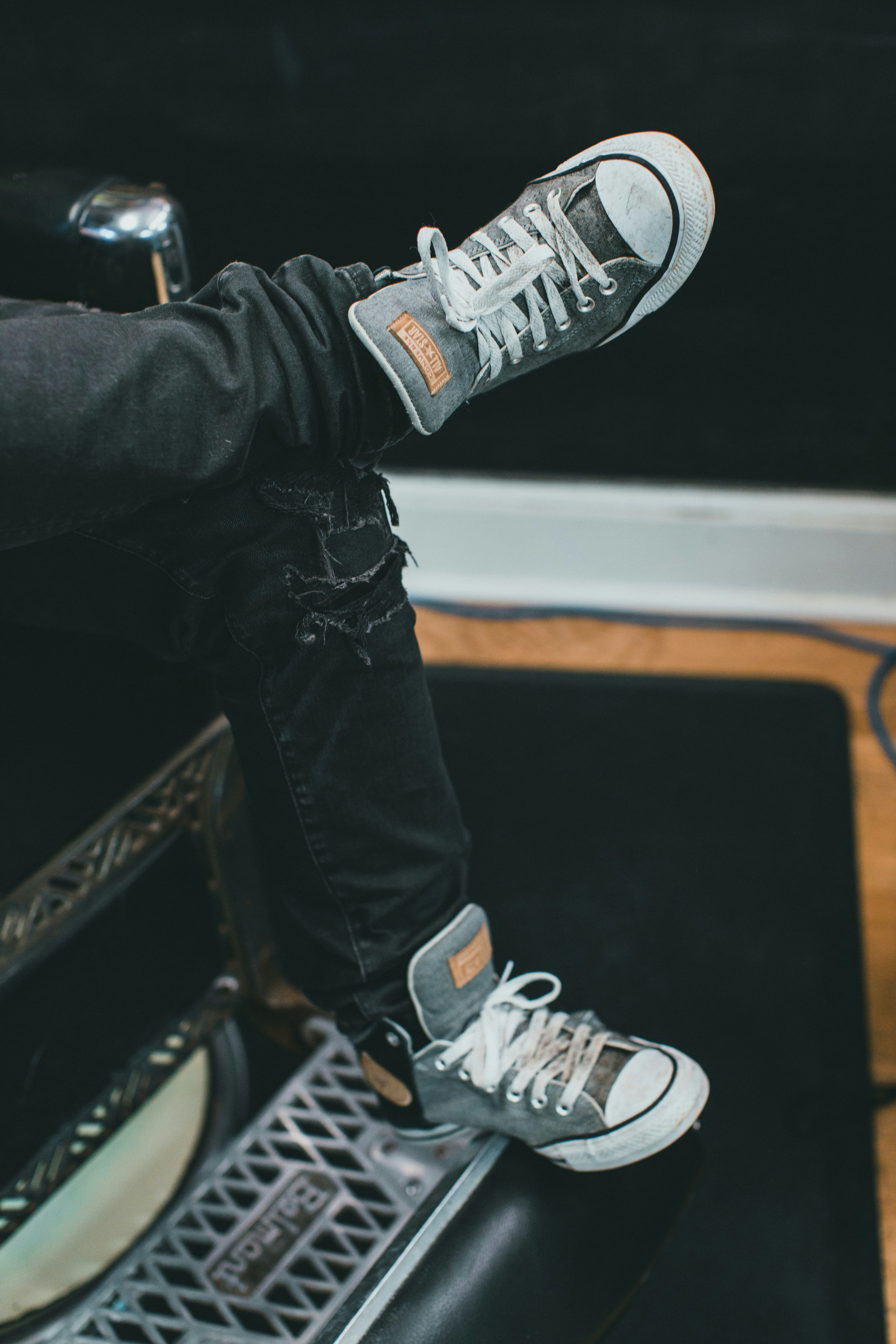 a person sitting on a chair with their feet up