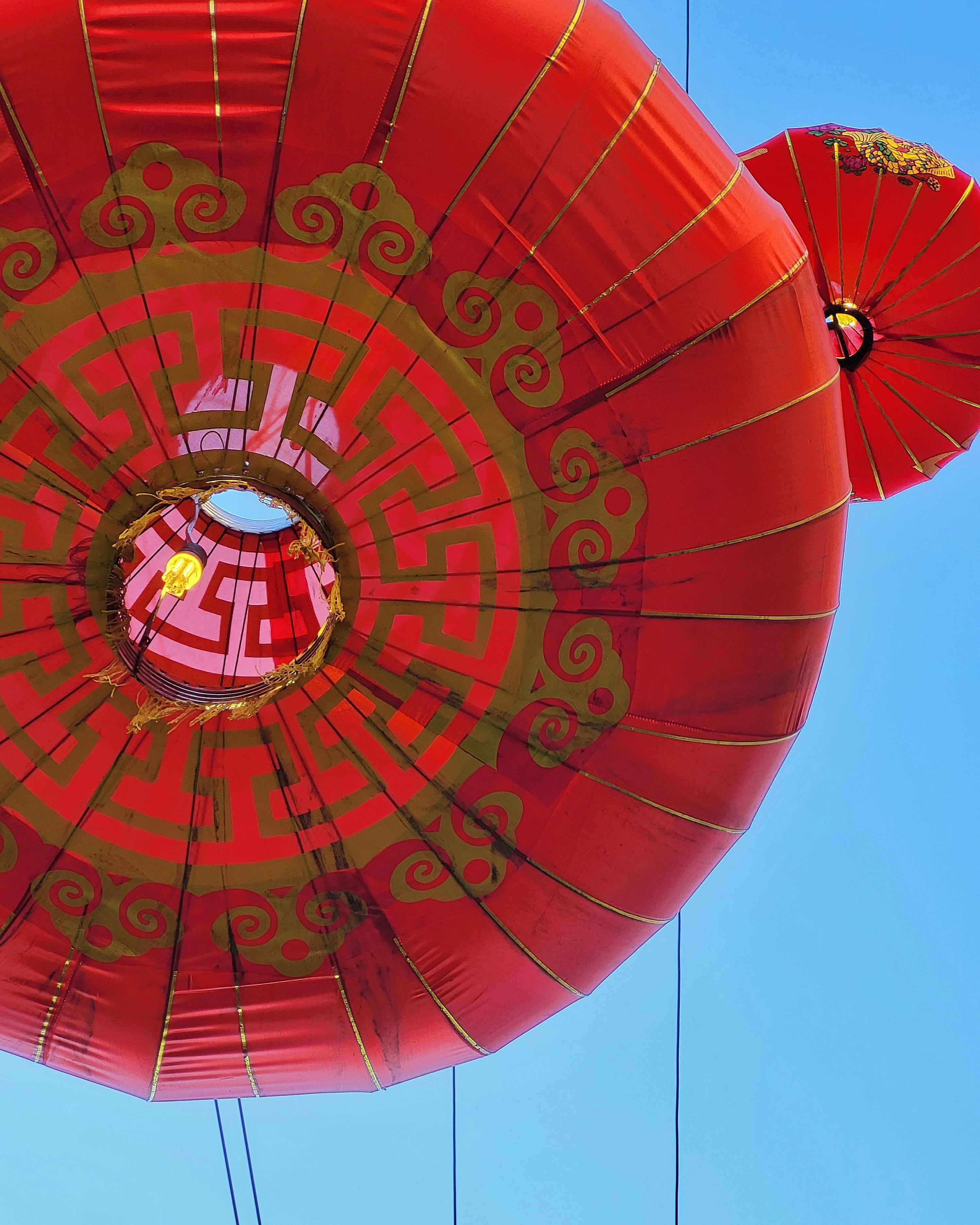 A close up of a large red balloon in the sky photo – Free Milano Image ...