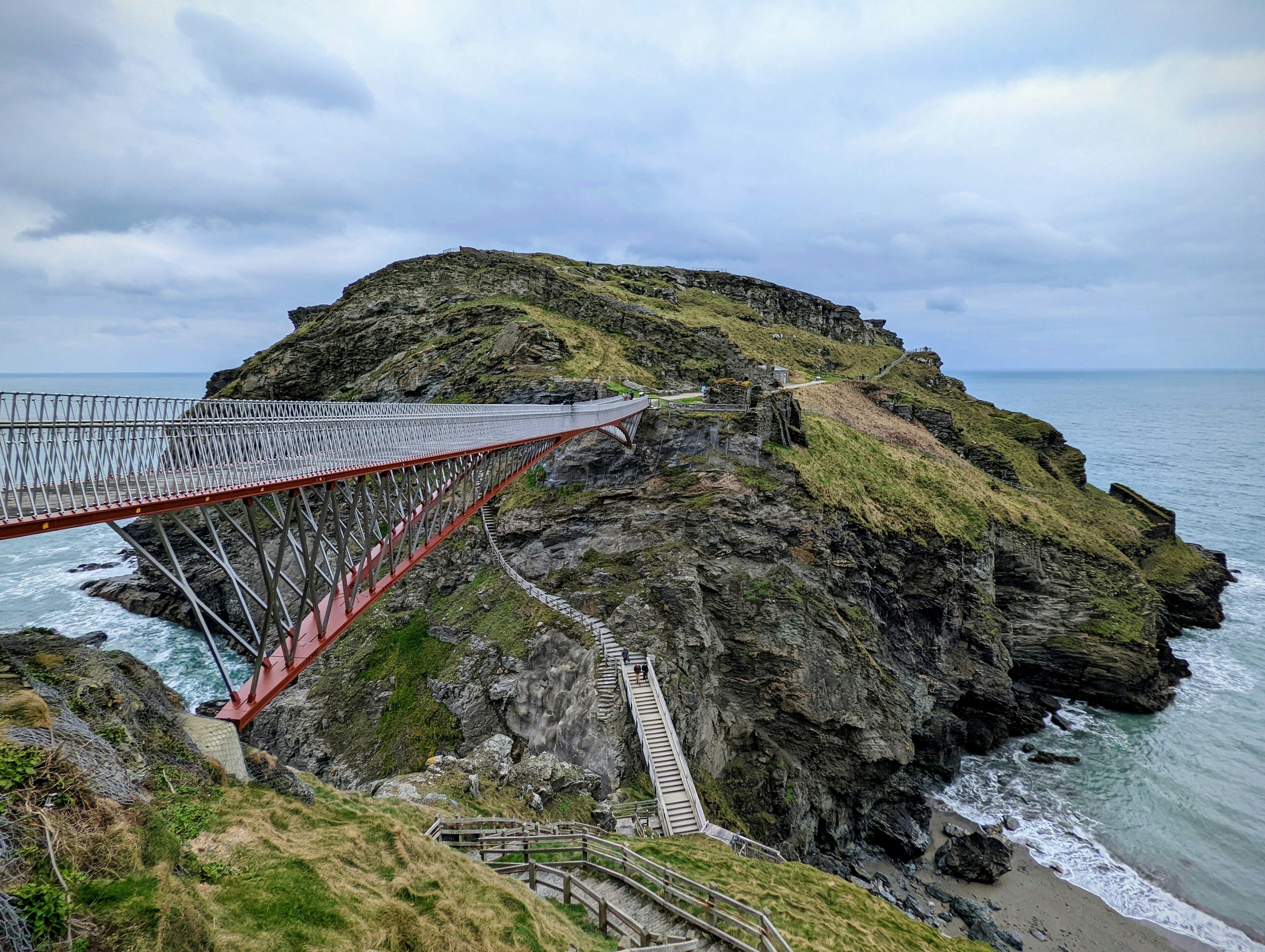 The Ribbon Above the Sea: A Cliffside Bridge to the Island