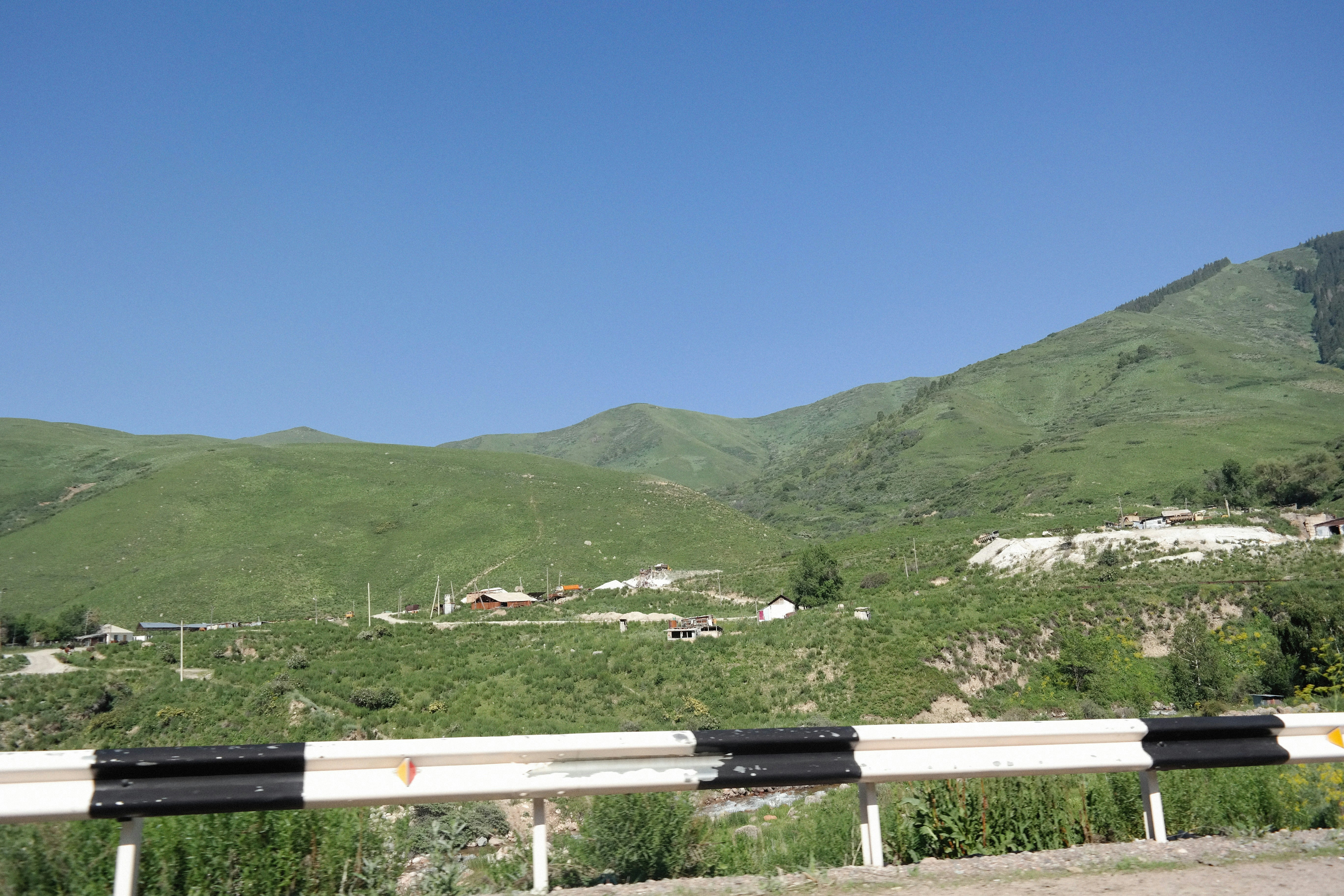 a view of a mountain range from a highway