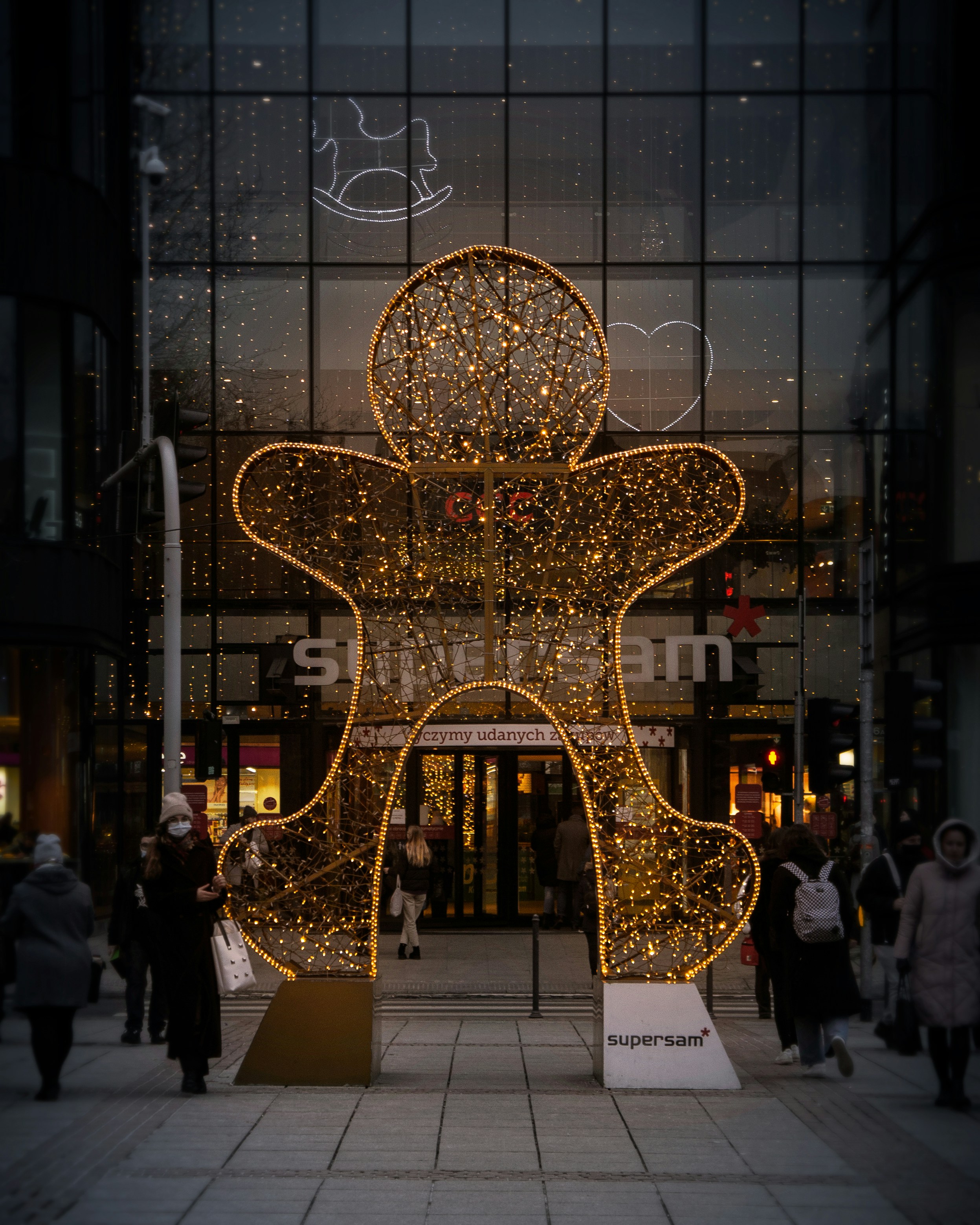 A large lighted teddy bear in front of a building photo – Free Building ...