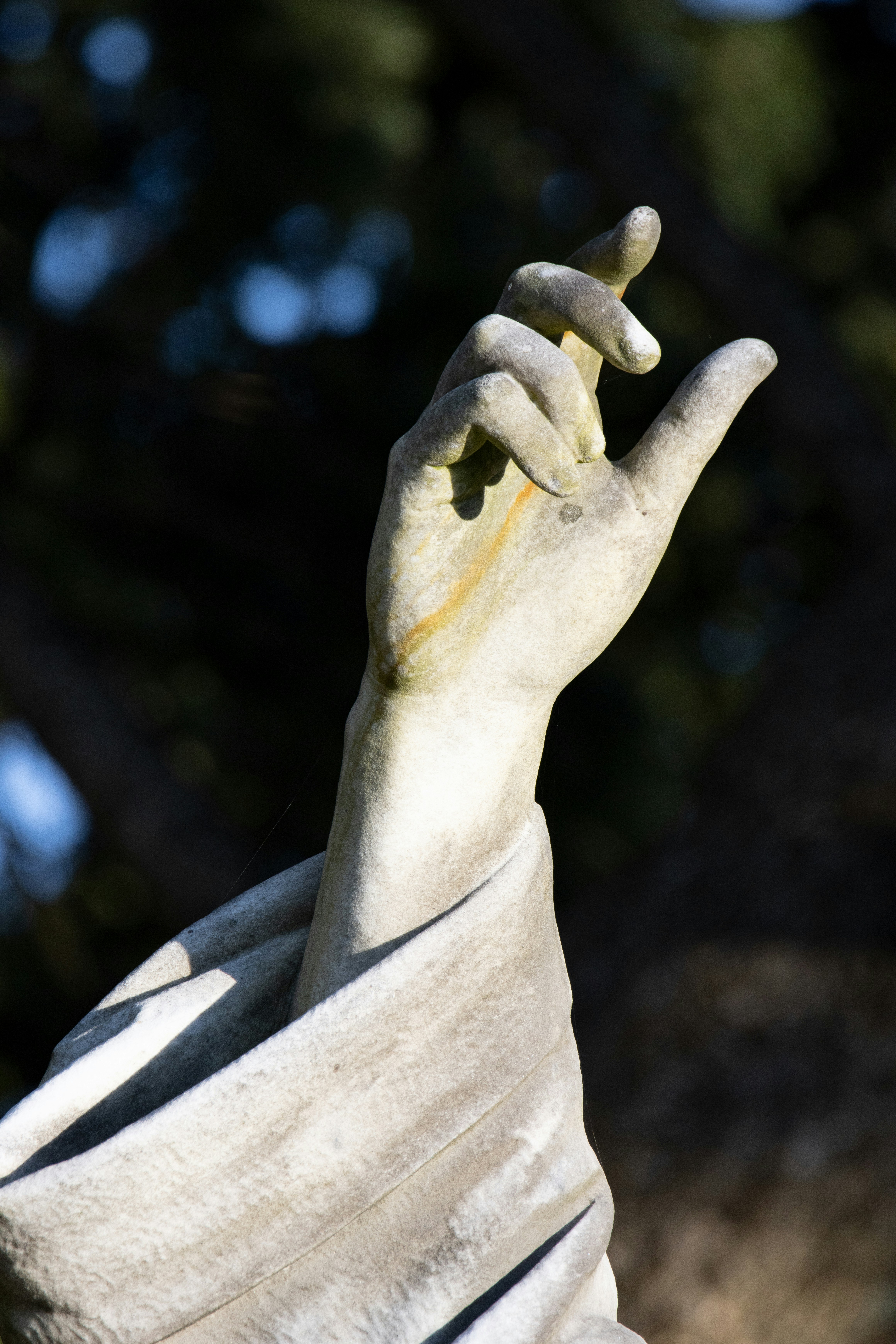 A statue of a hand reaching up into the air photo – Free Statue Image ...