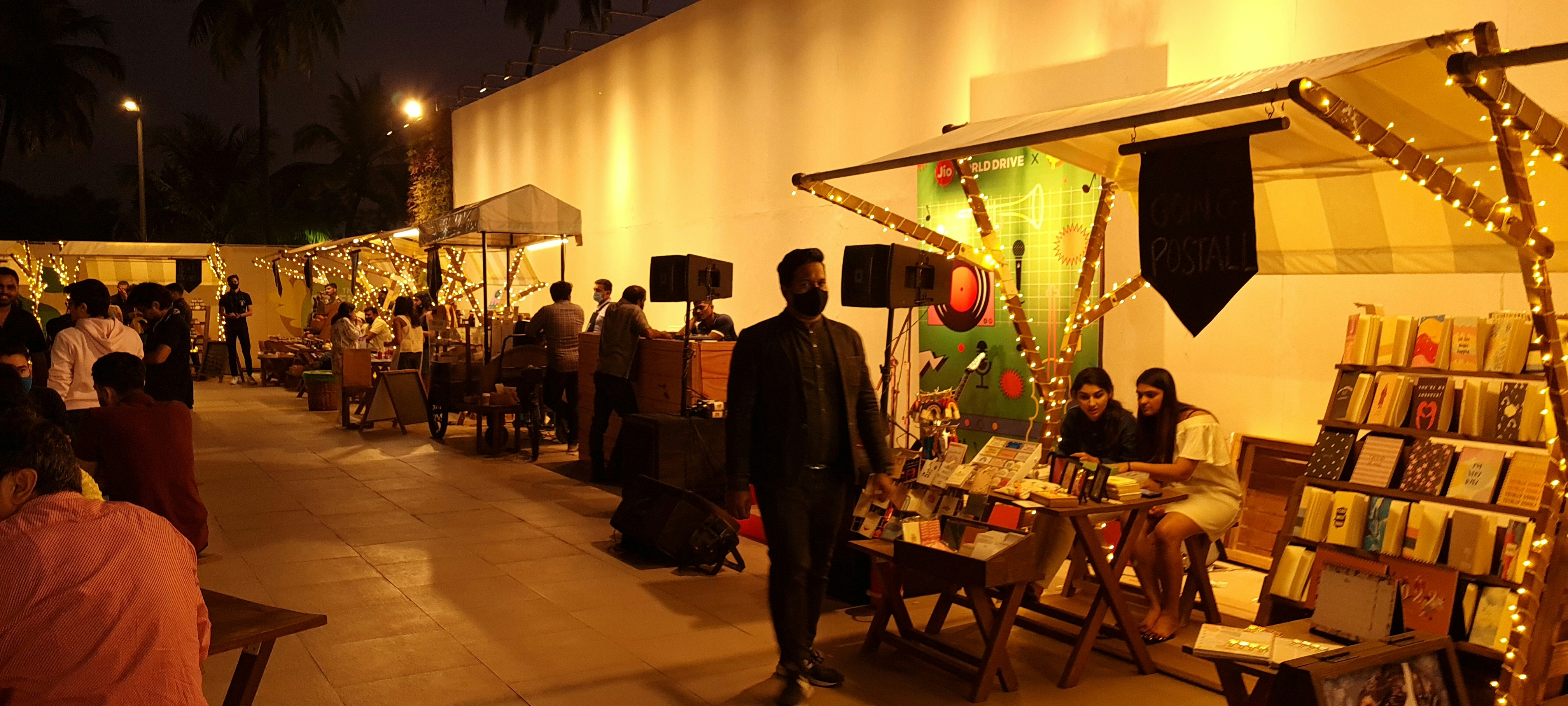 a group of people standing outside of a store