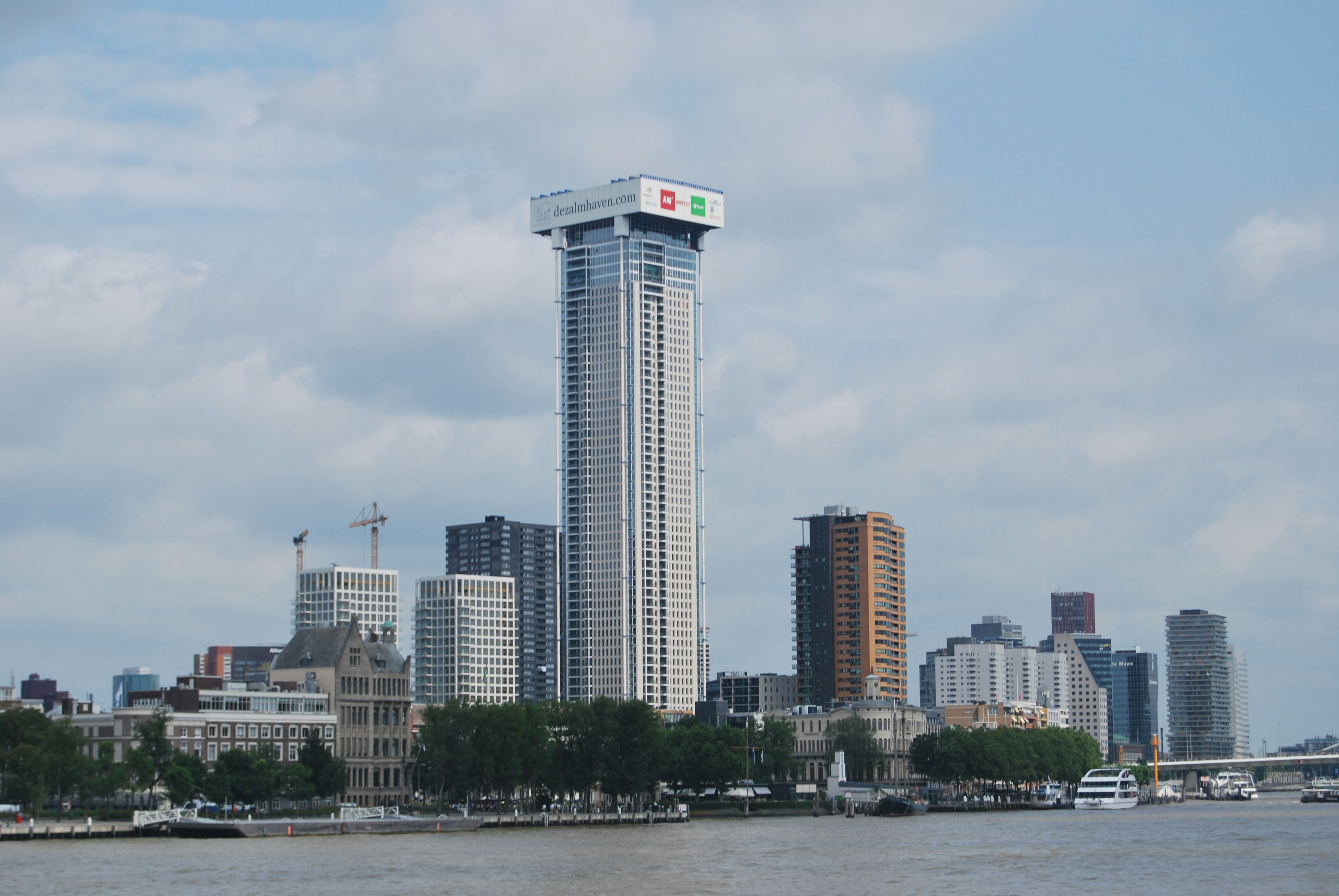 White Spire Rising Over a Calm Riverside Skyline