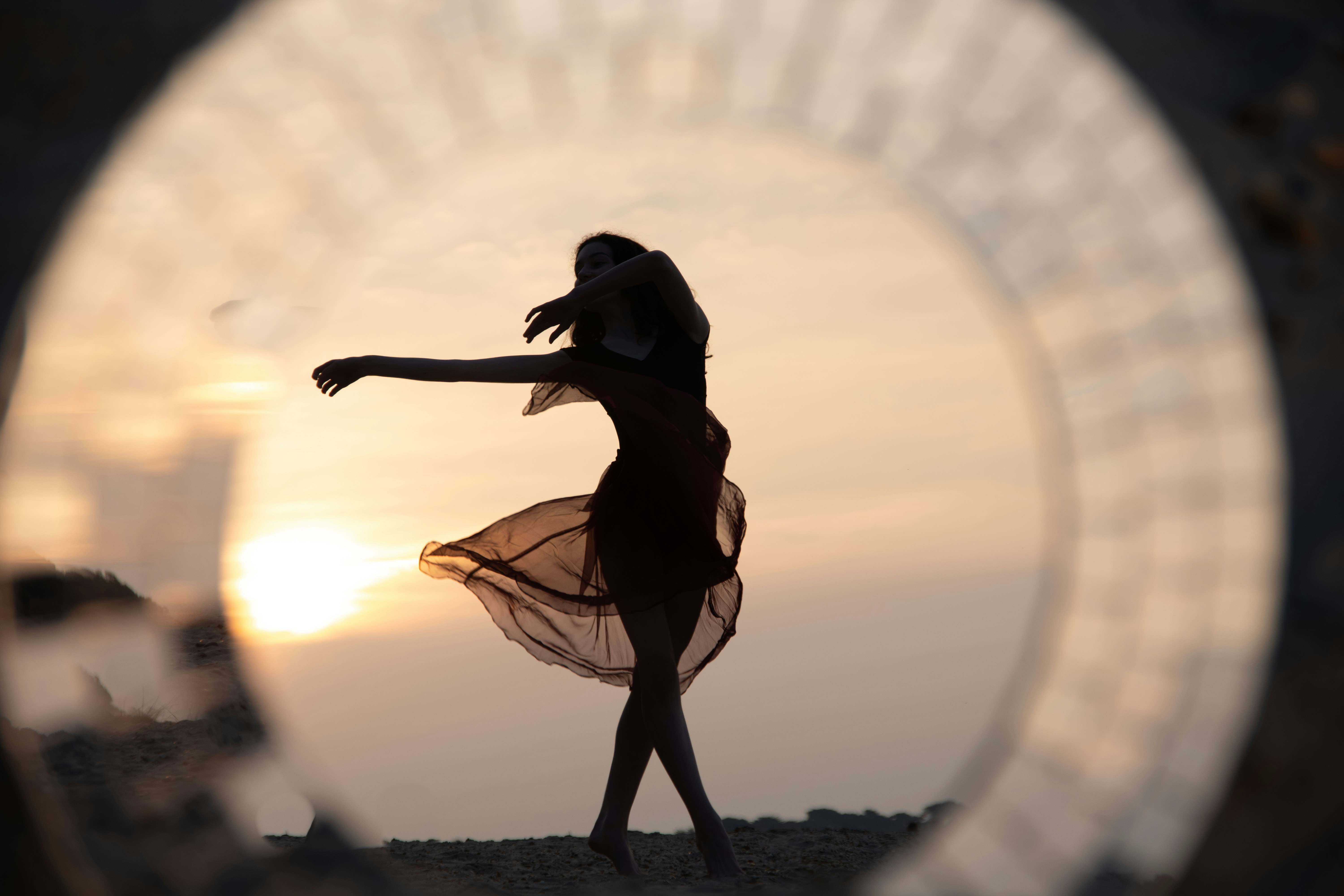 A woman in a dress is dancing on the beach photo – Free Human Image on ...