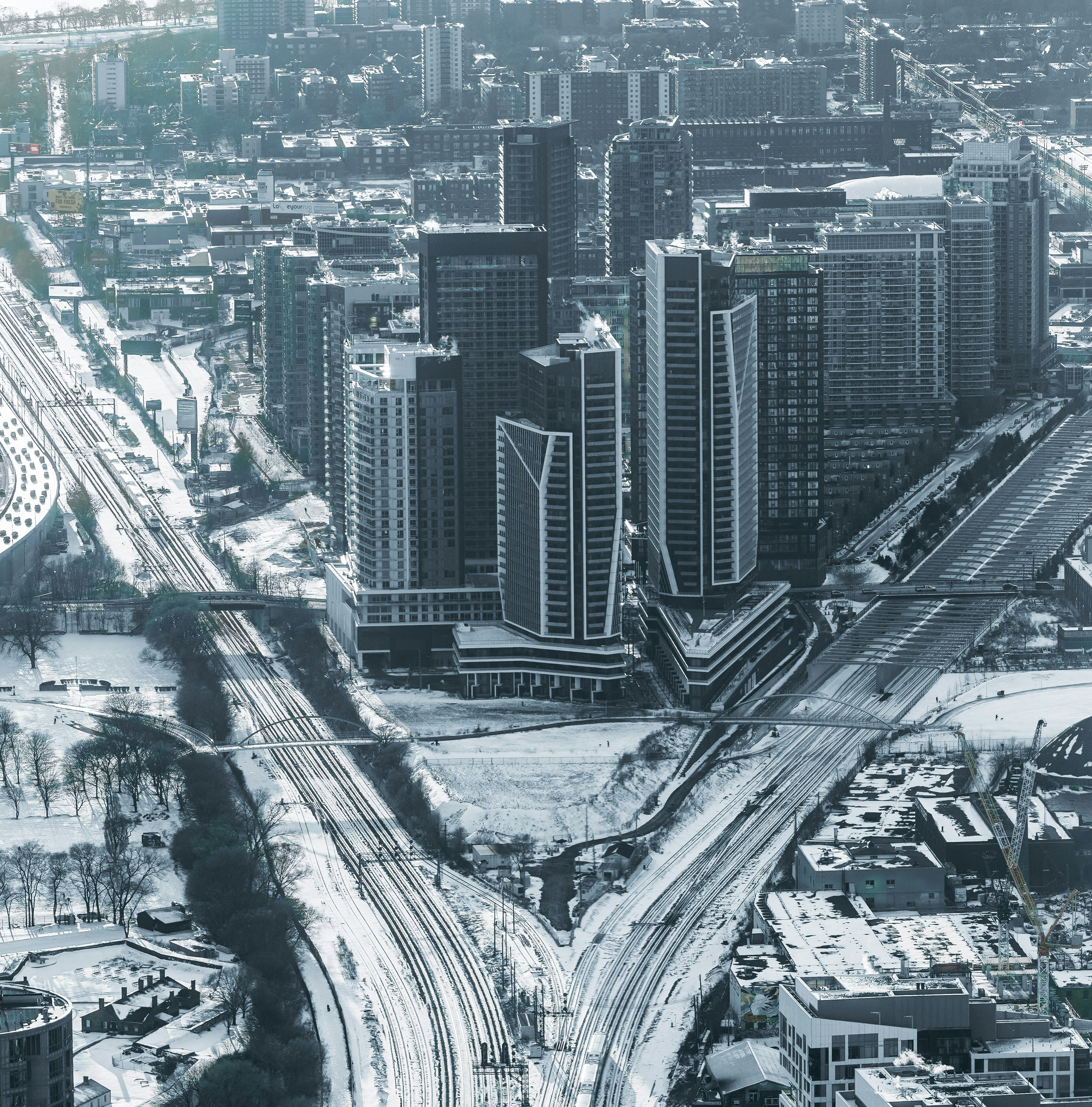 Icy Convergence: Glass Towers Framing a Winter City Interchange