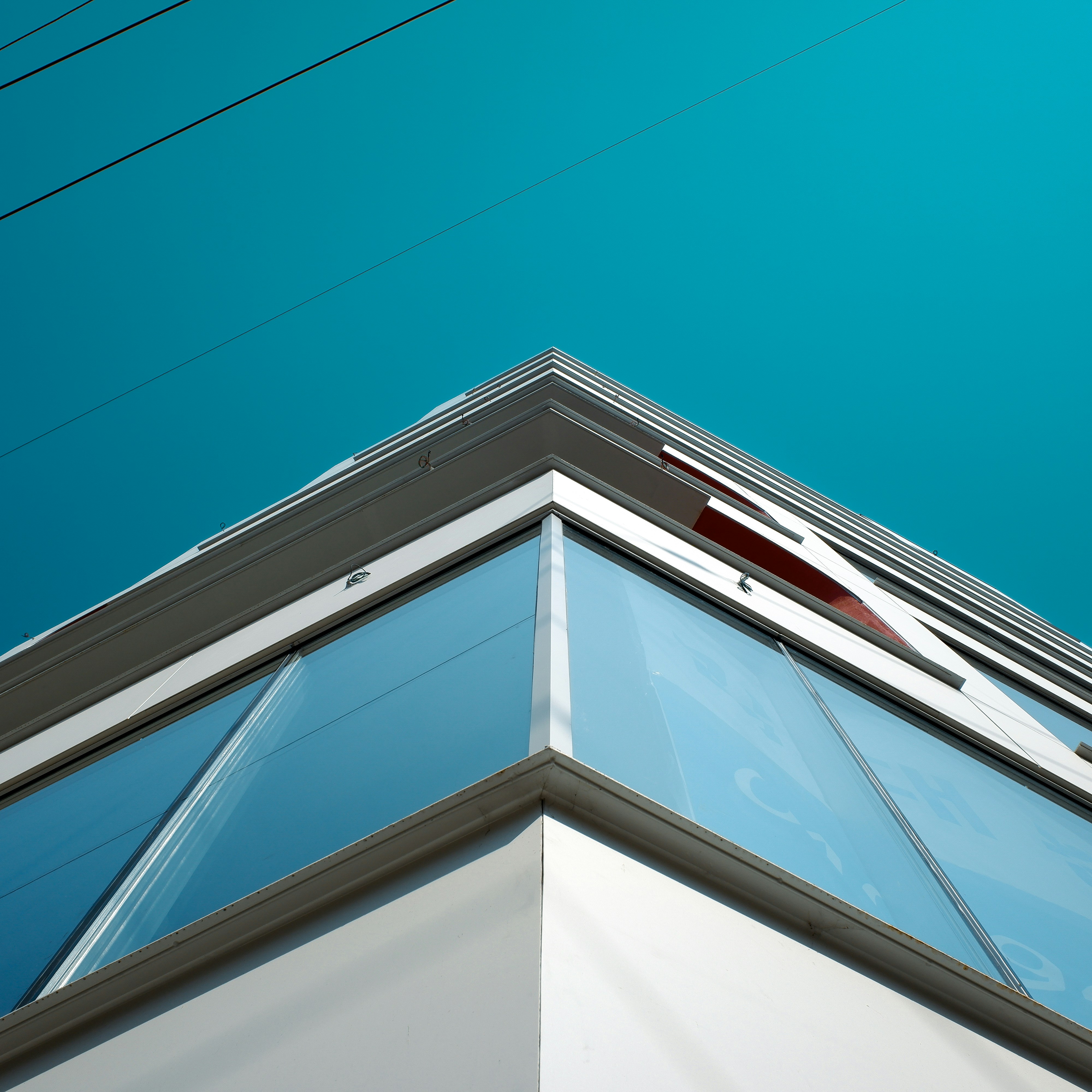 Corner of Glass and Sky: A Diagonal Modernist Edge