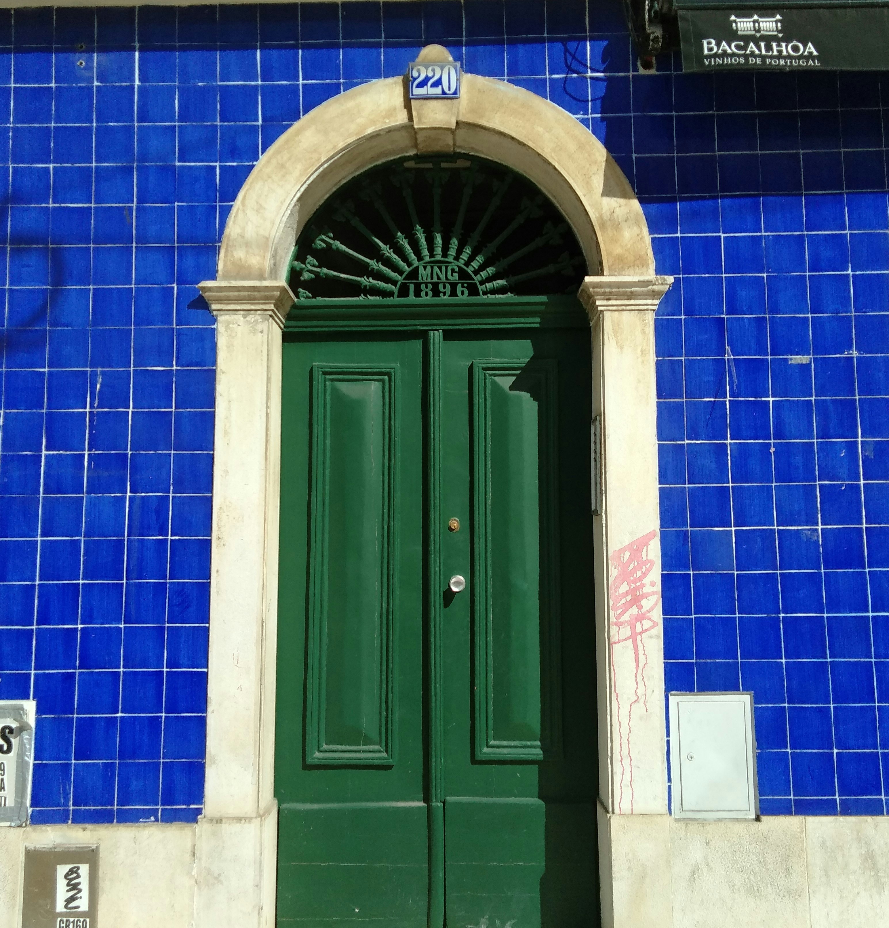 Emerald Doorway Amid Indigo Tilework