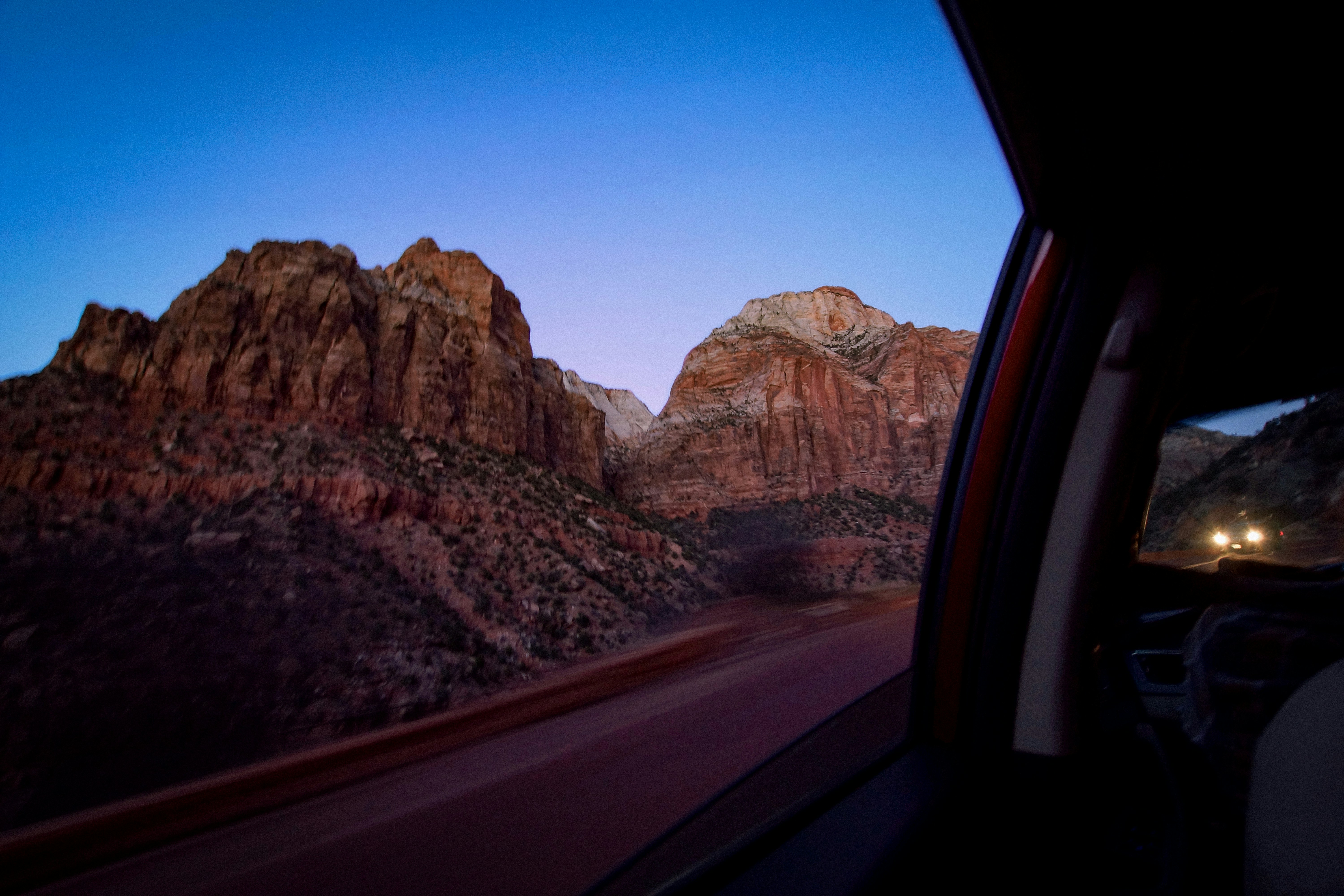the view from inside a car of a mountain range