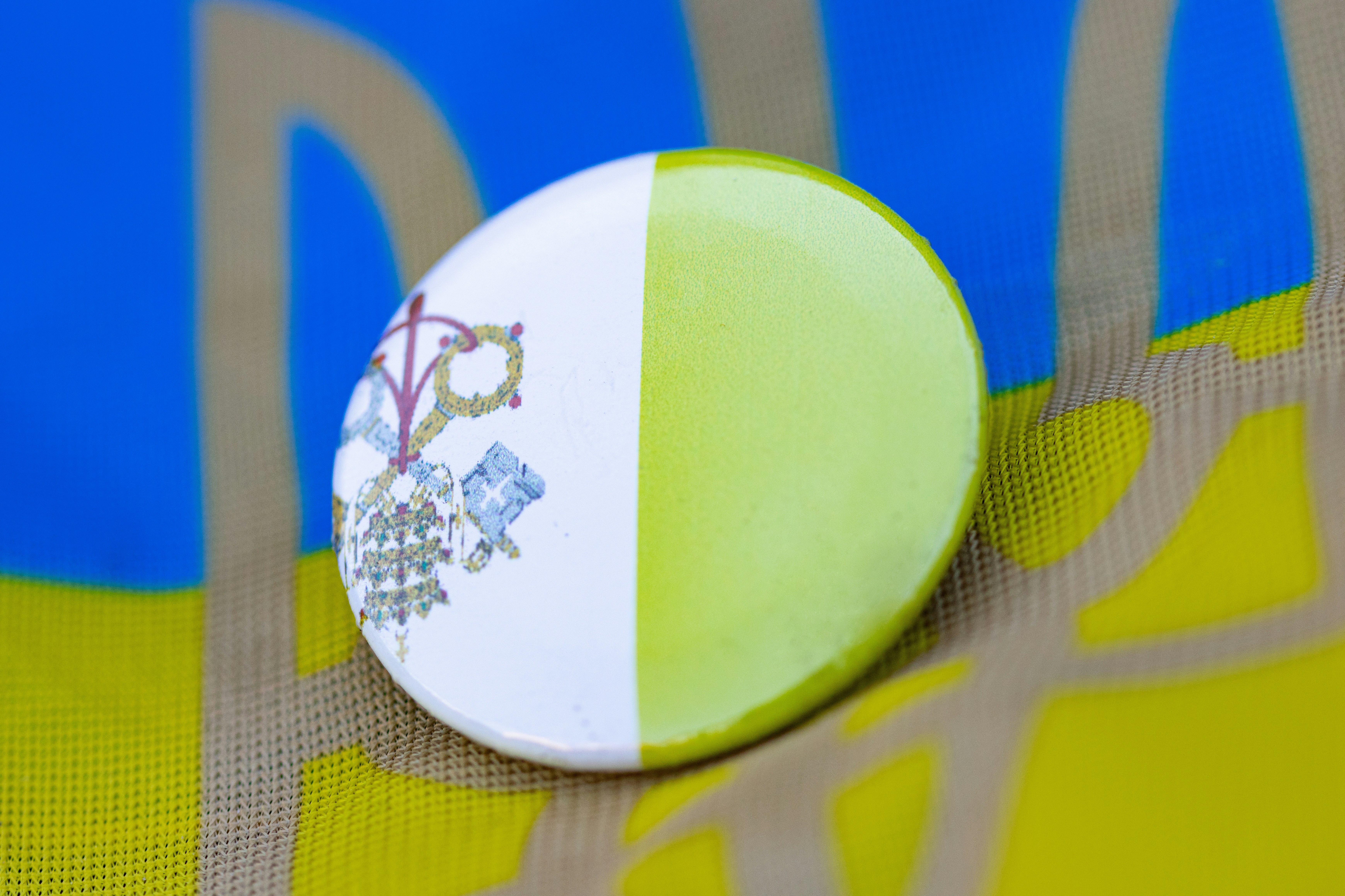 Two-Tone Enamel Badge Anchored by a Blue-Yellow Banner
