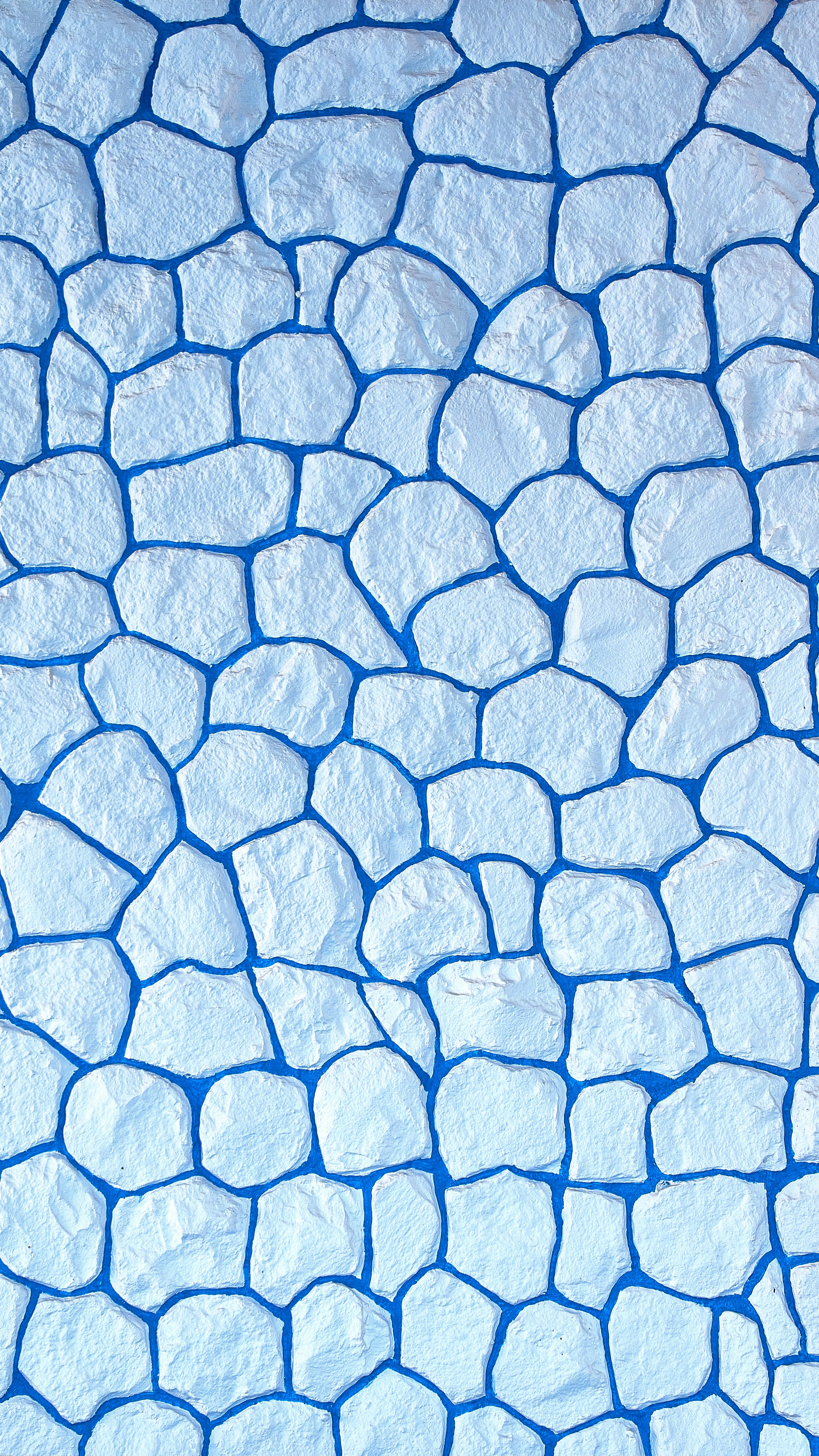 A close up of a blue and white stone wall photo – Free Blue Image on ...