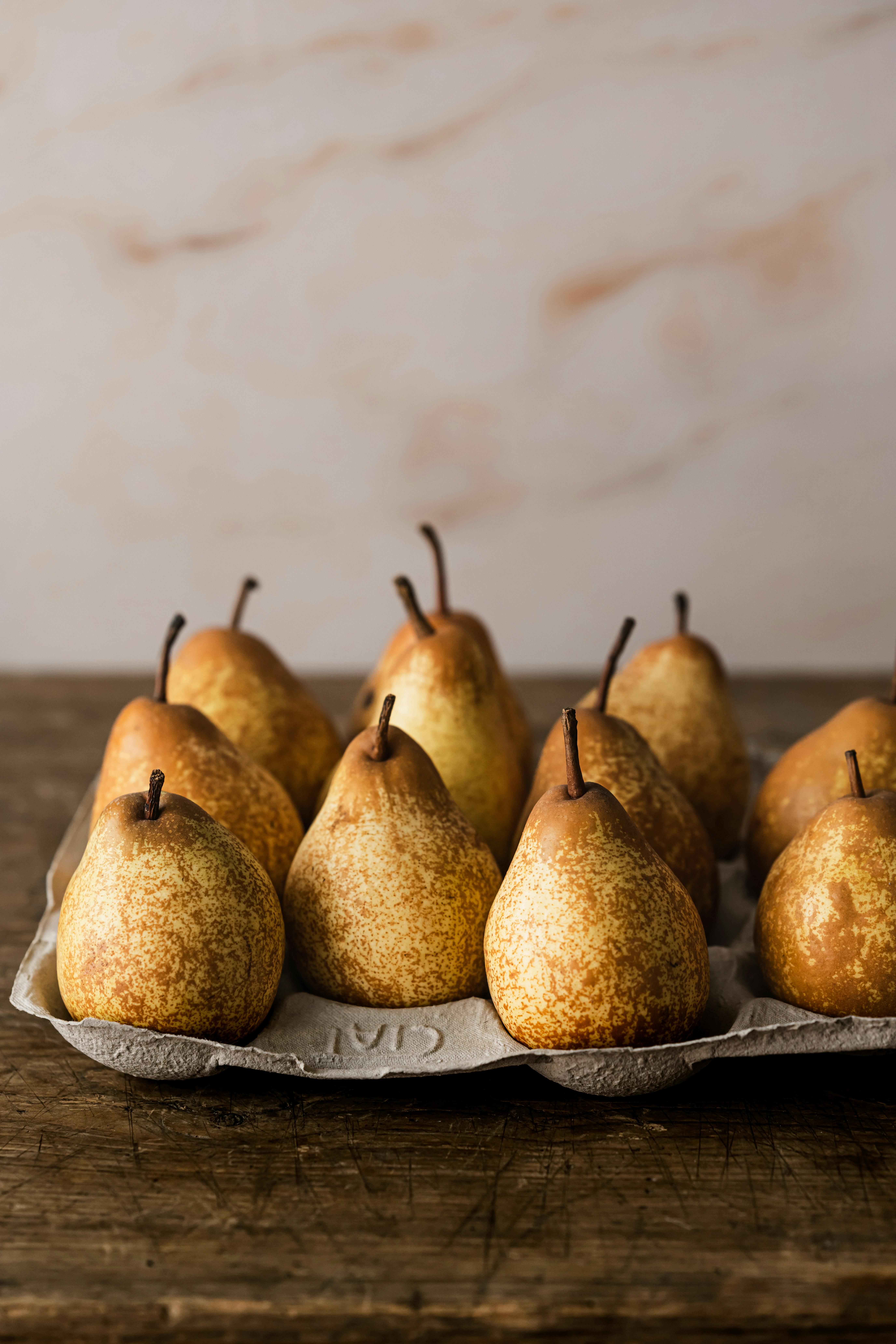 A pear with fruit on top of a wooden table photo – Free Fruit Image on ...