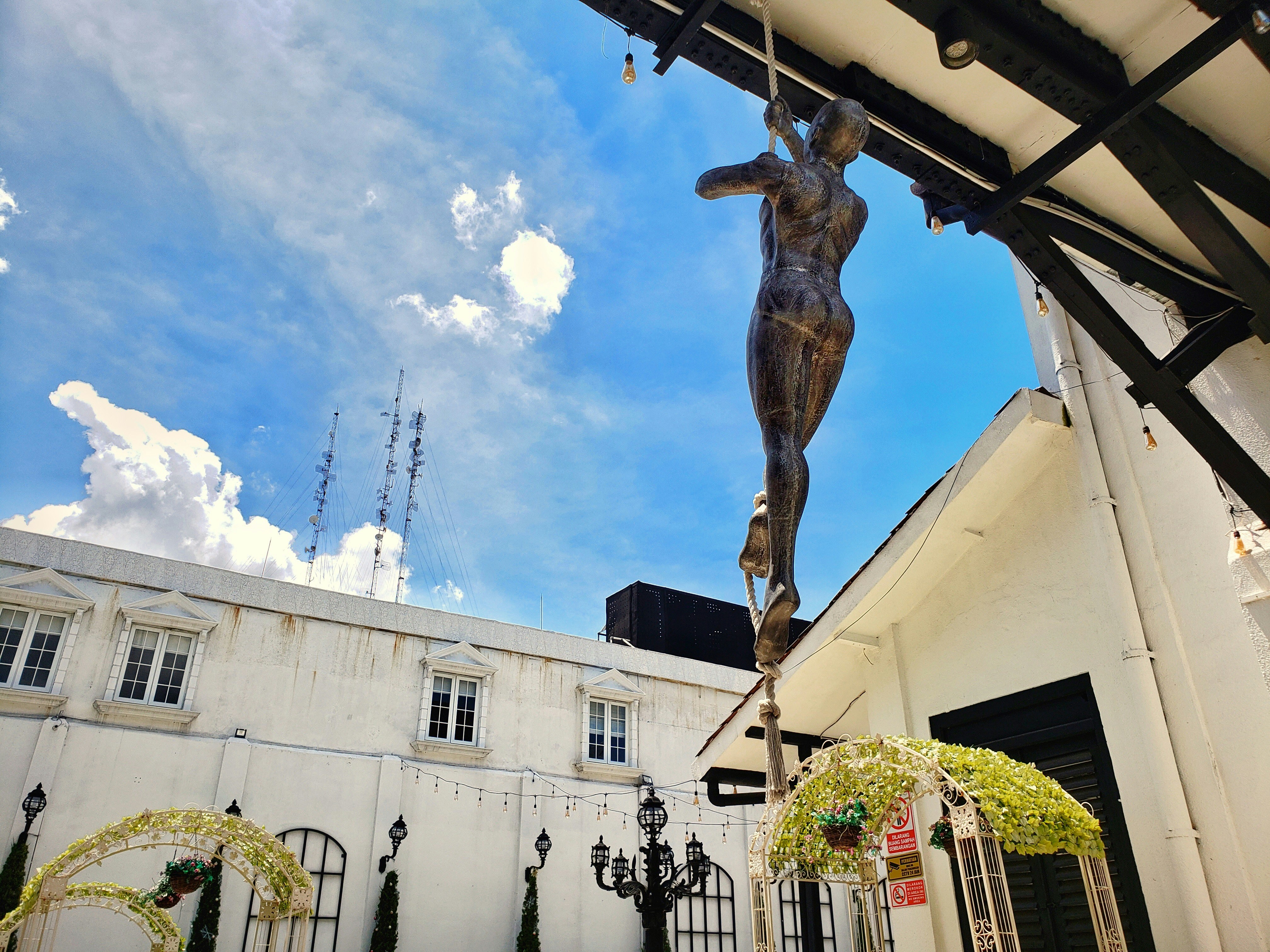 Suspended Sculpture Under a Blue Sky