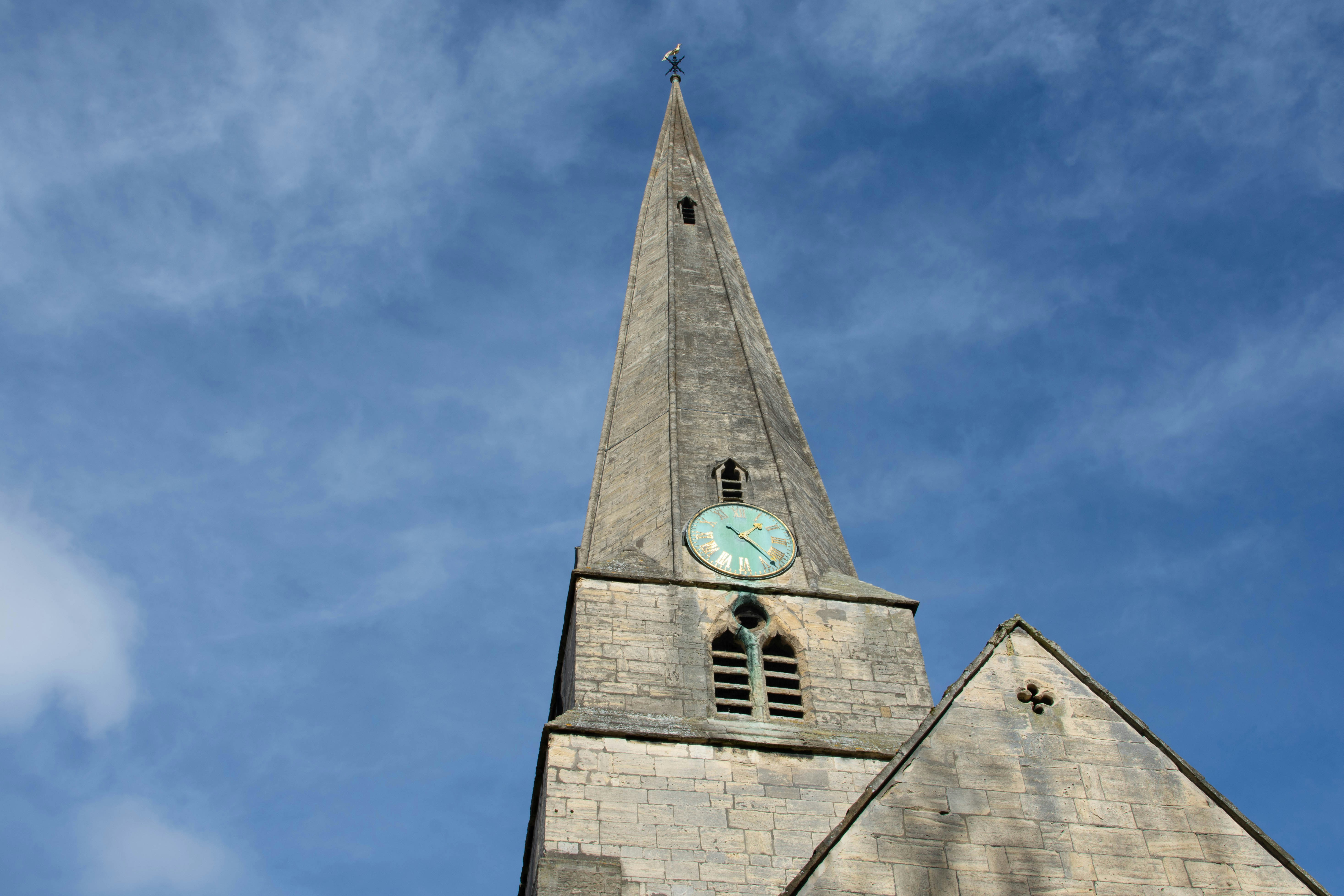 a church steeple with a clock on it