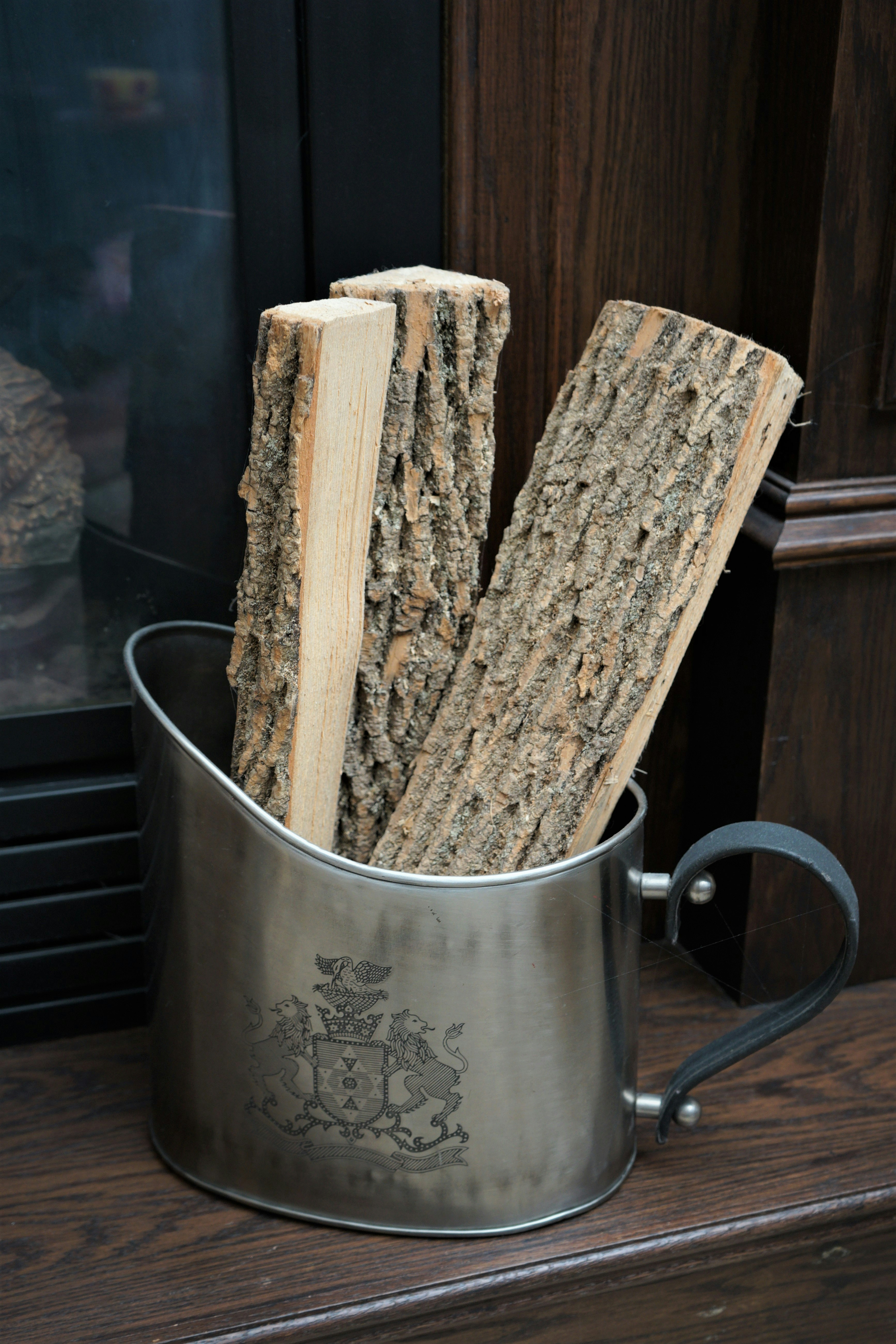 Log Holder: Timber Staves in a Weathered Metal Mug