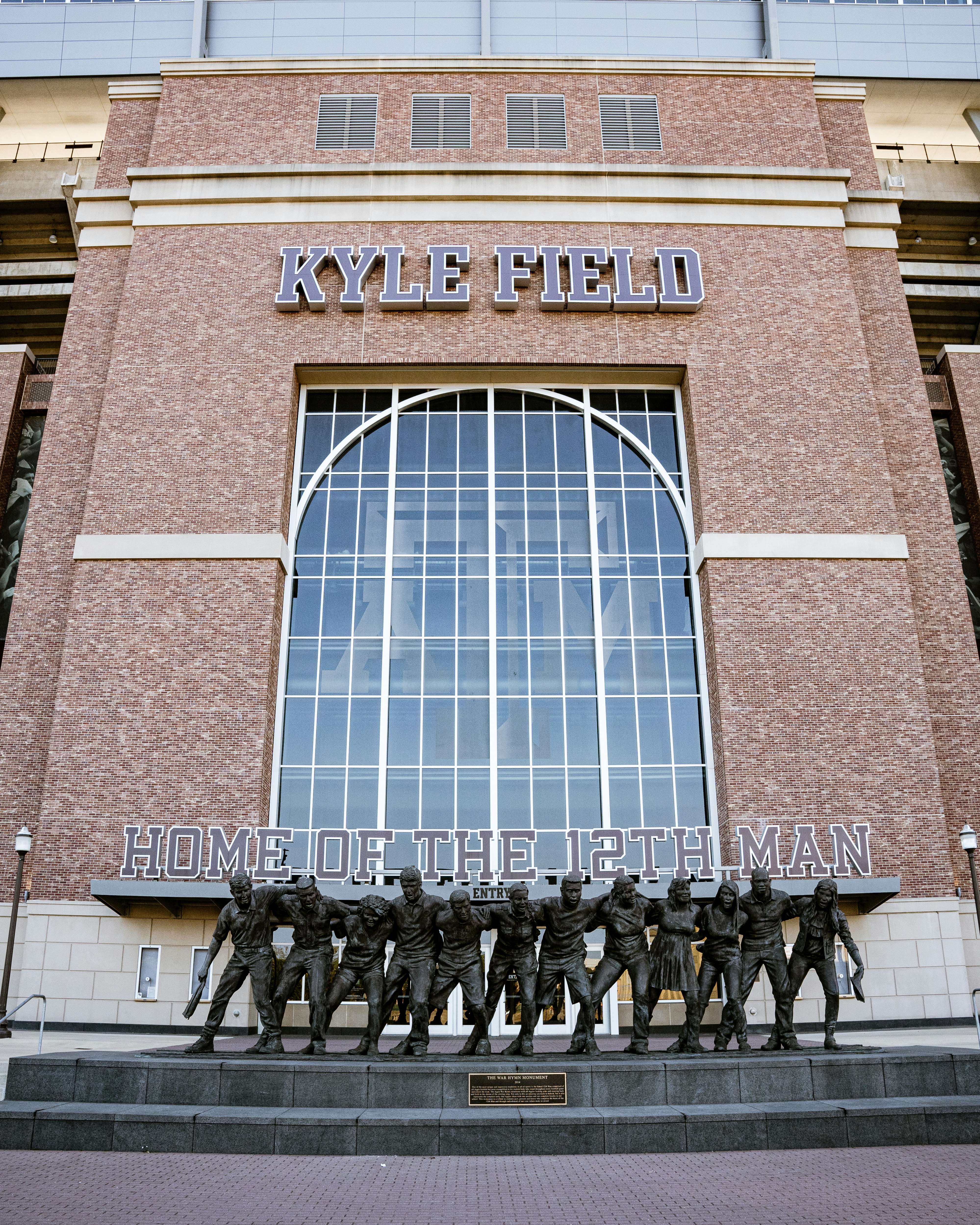 A statue of a group of men in front of a building photo – Free Kyle ...