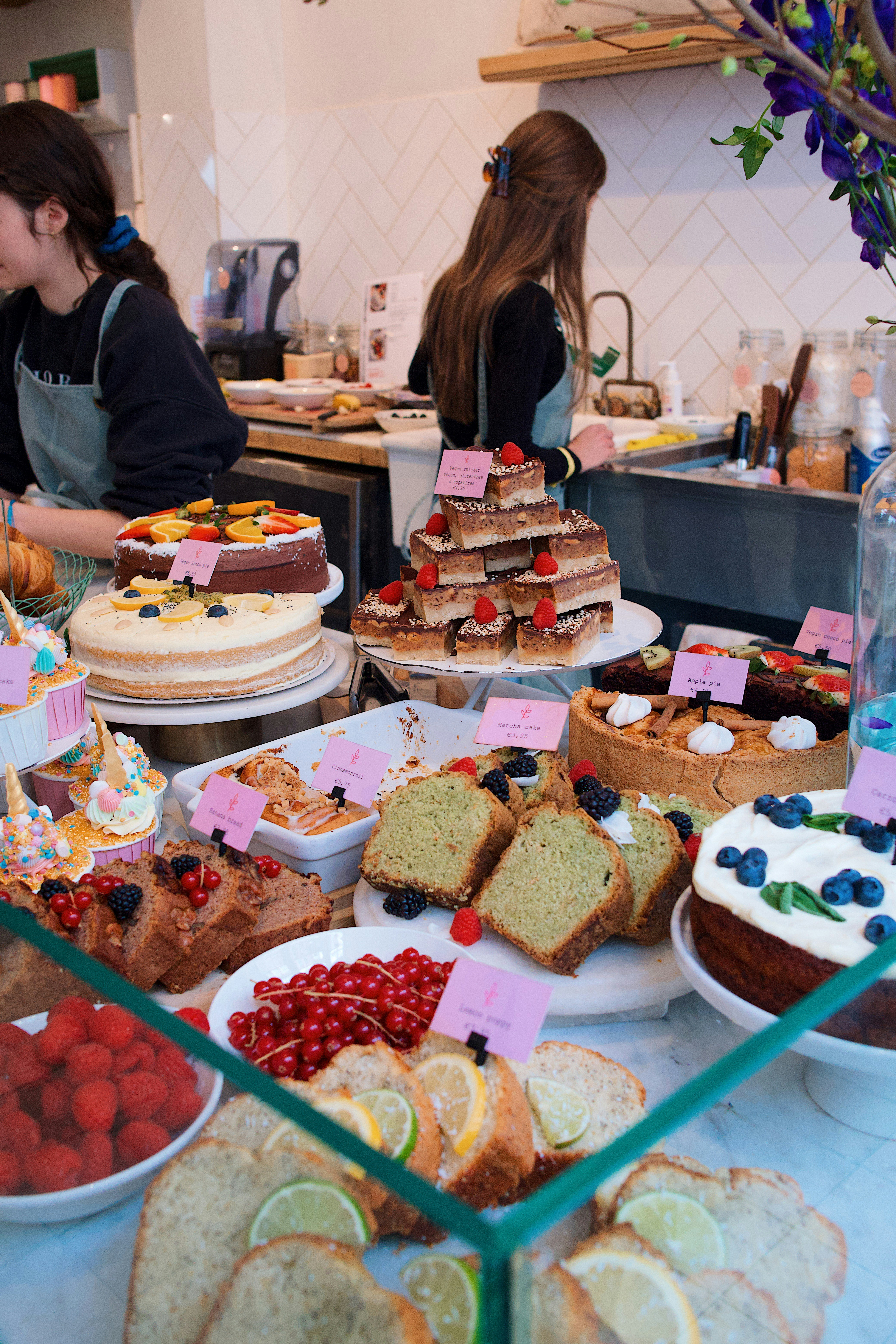 A table filled with lots of cakes and desserts photo – Free Human Image ...