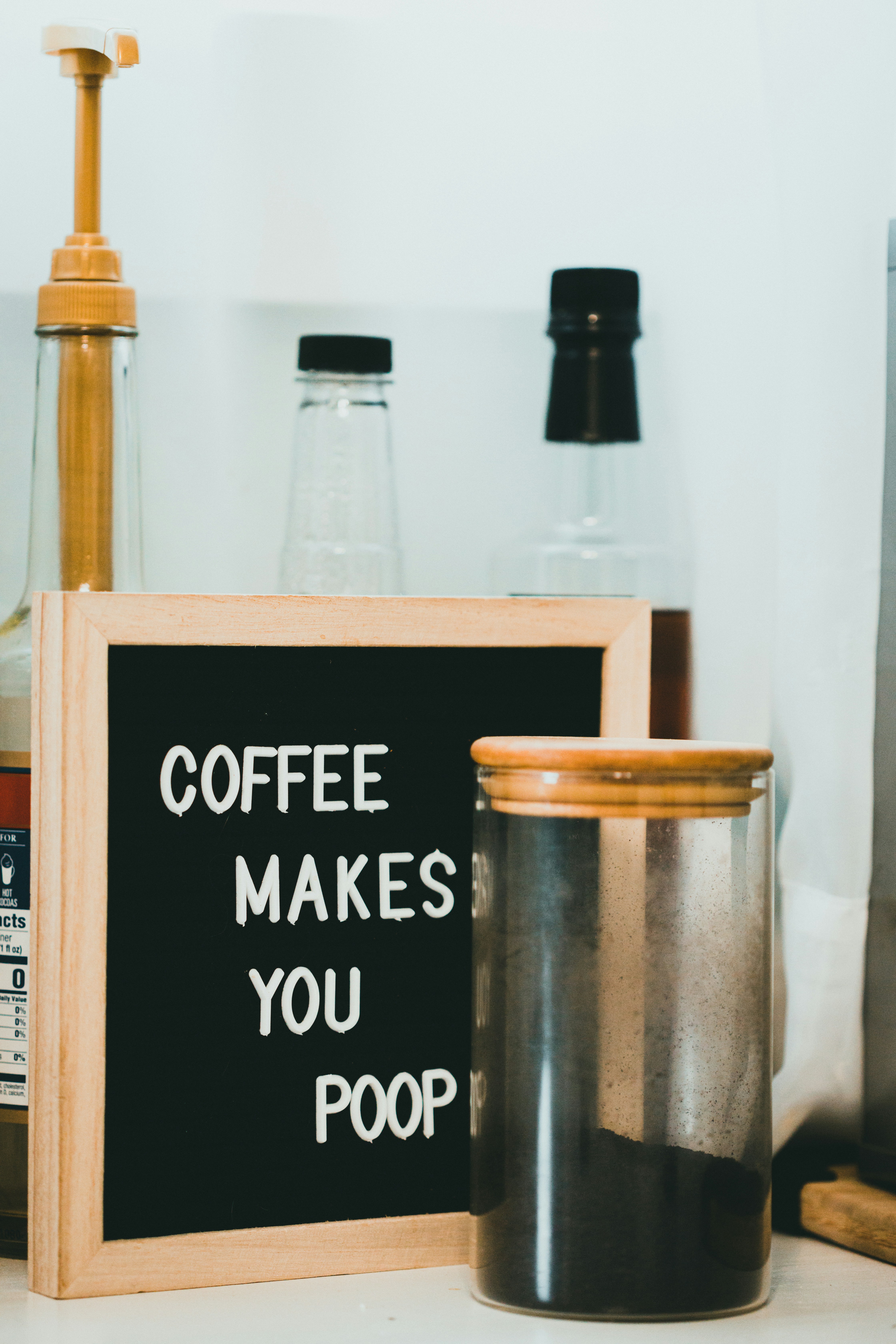 A sign that says coffee makes you poop photo – Free Grey Image on Unsplash