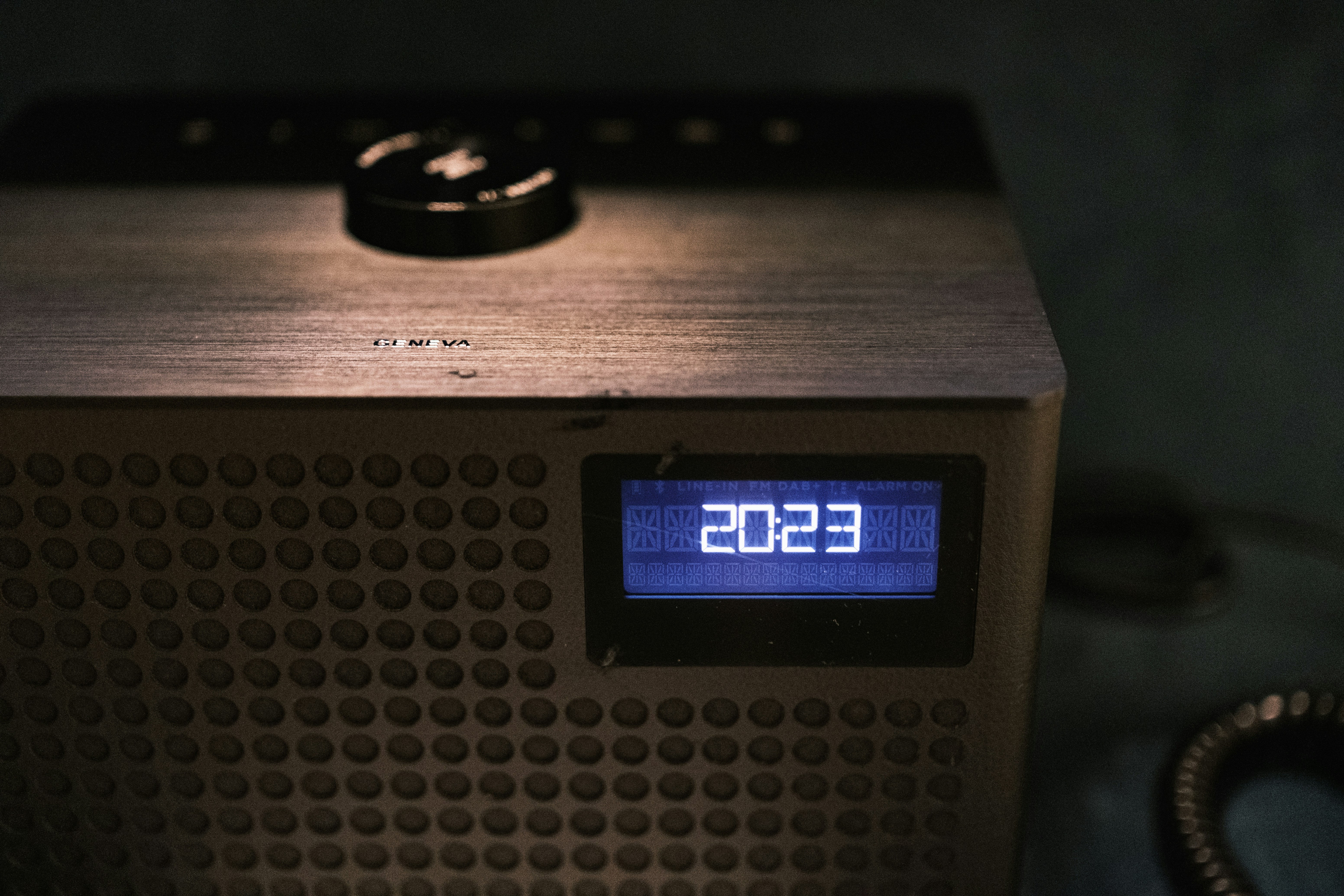 Blue Digits Illuminate a Vintage Radio: 2023 in Focus