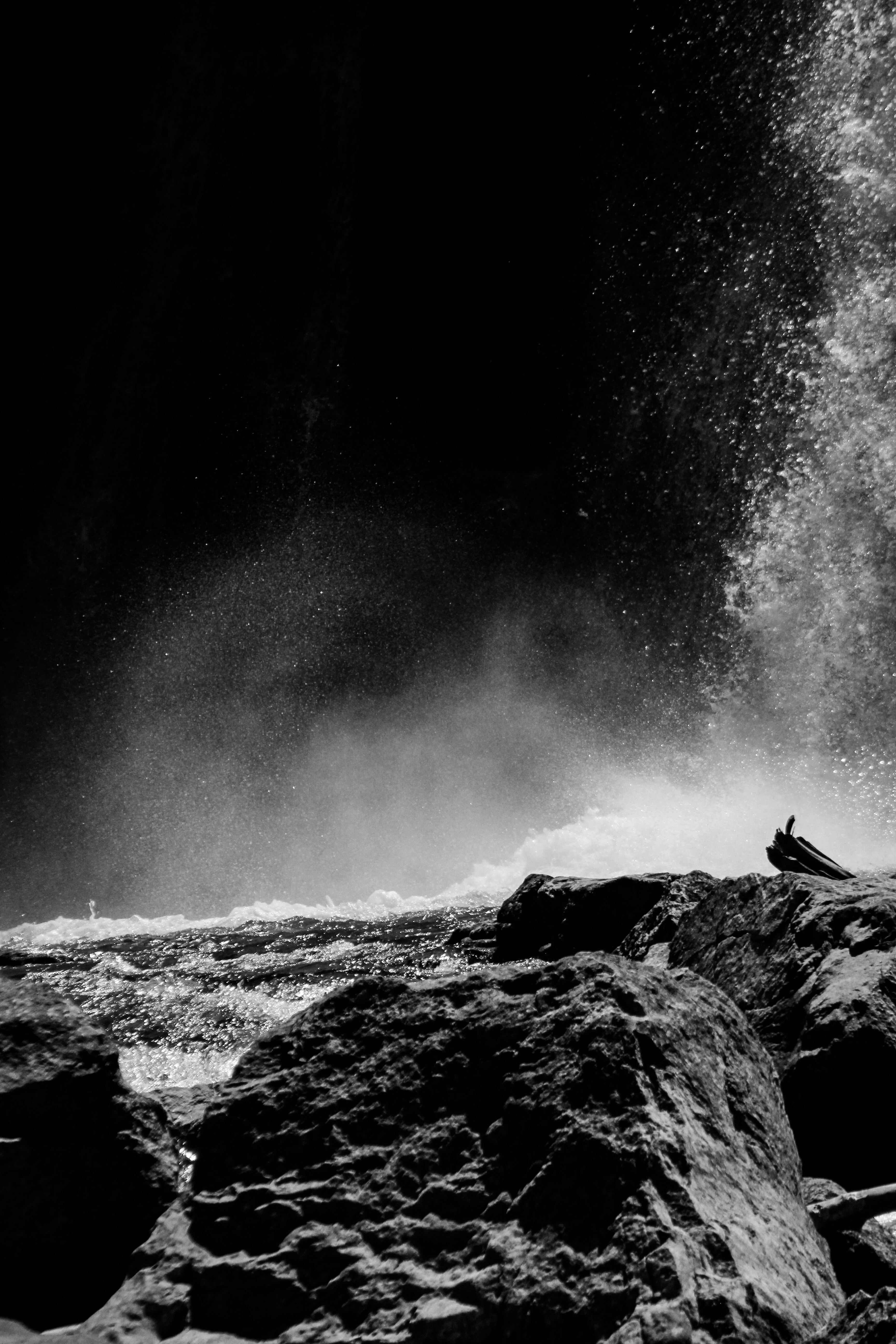 A man riding a snowboard on top of a large wave photo – Free Grey Image ...