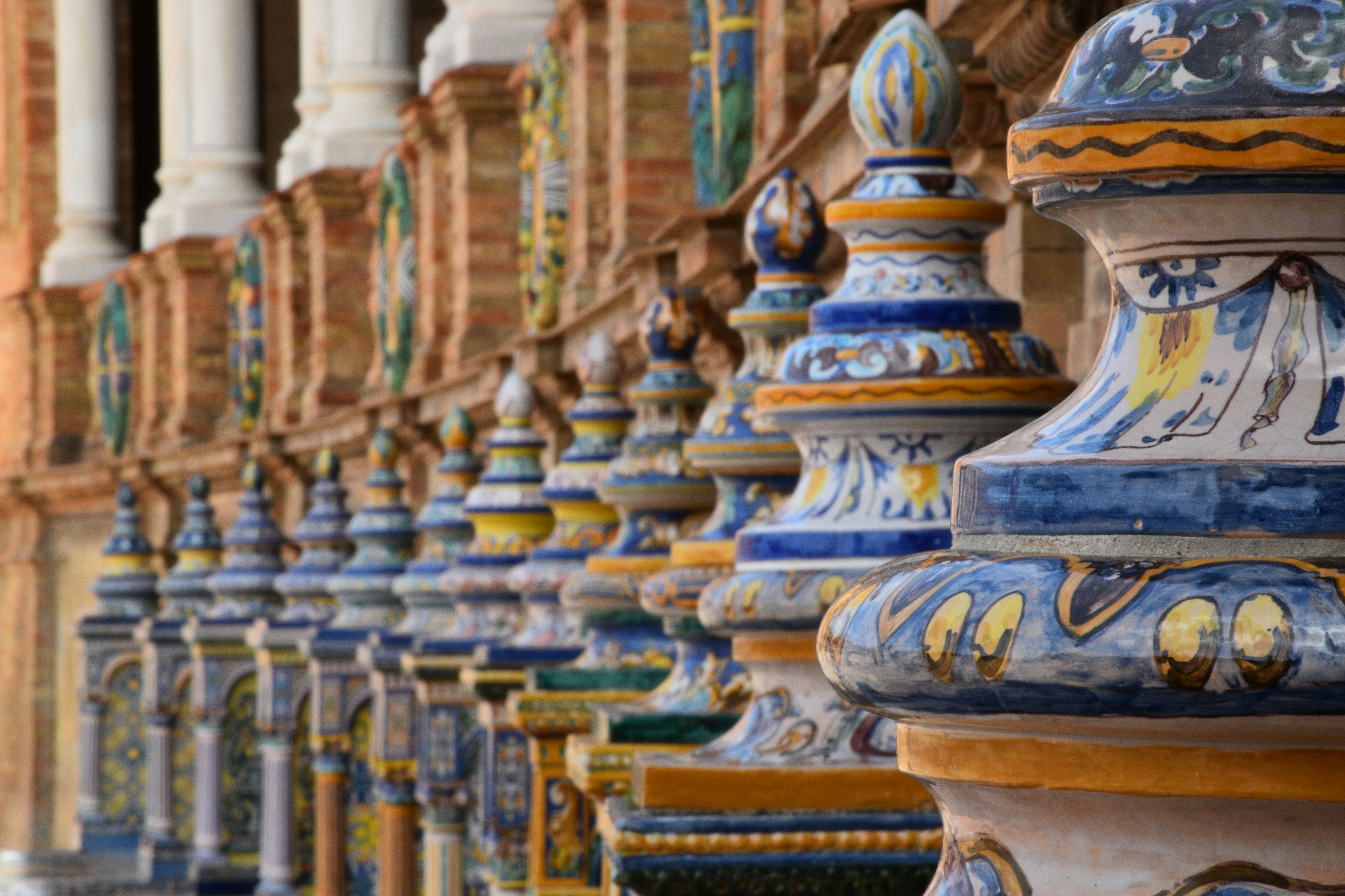 Colorful Ceramic Capitals: A Receding Corridor of Painted Columns