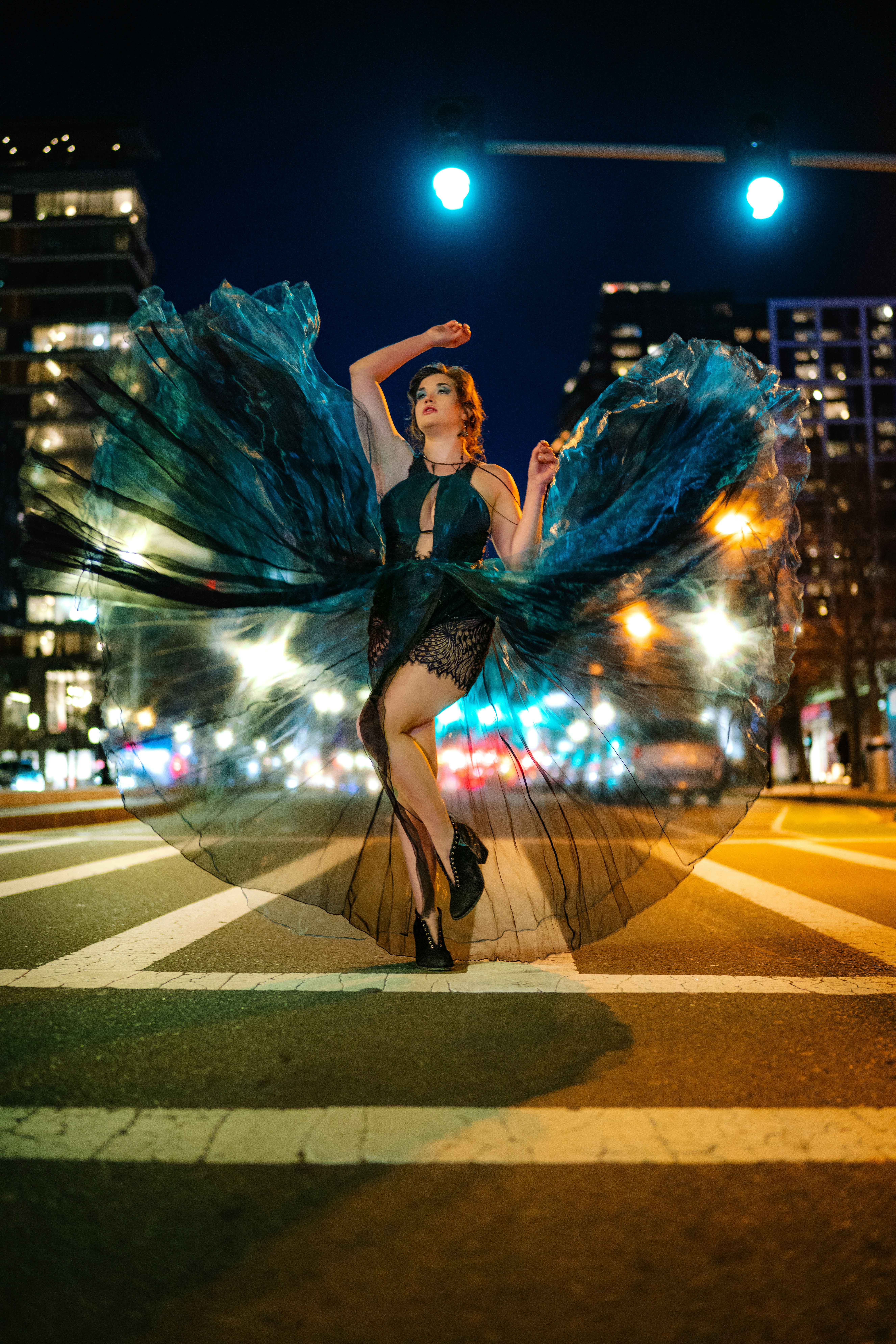 A woman is dancing on the street at night photo – Free United states ...