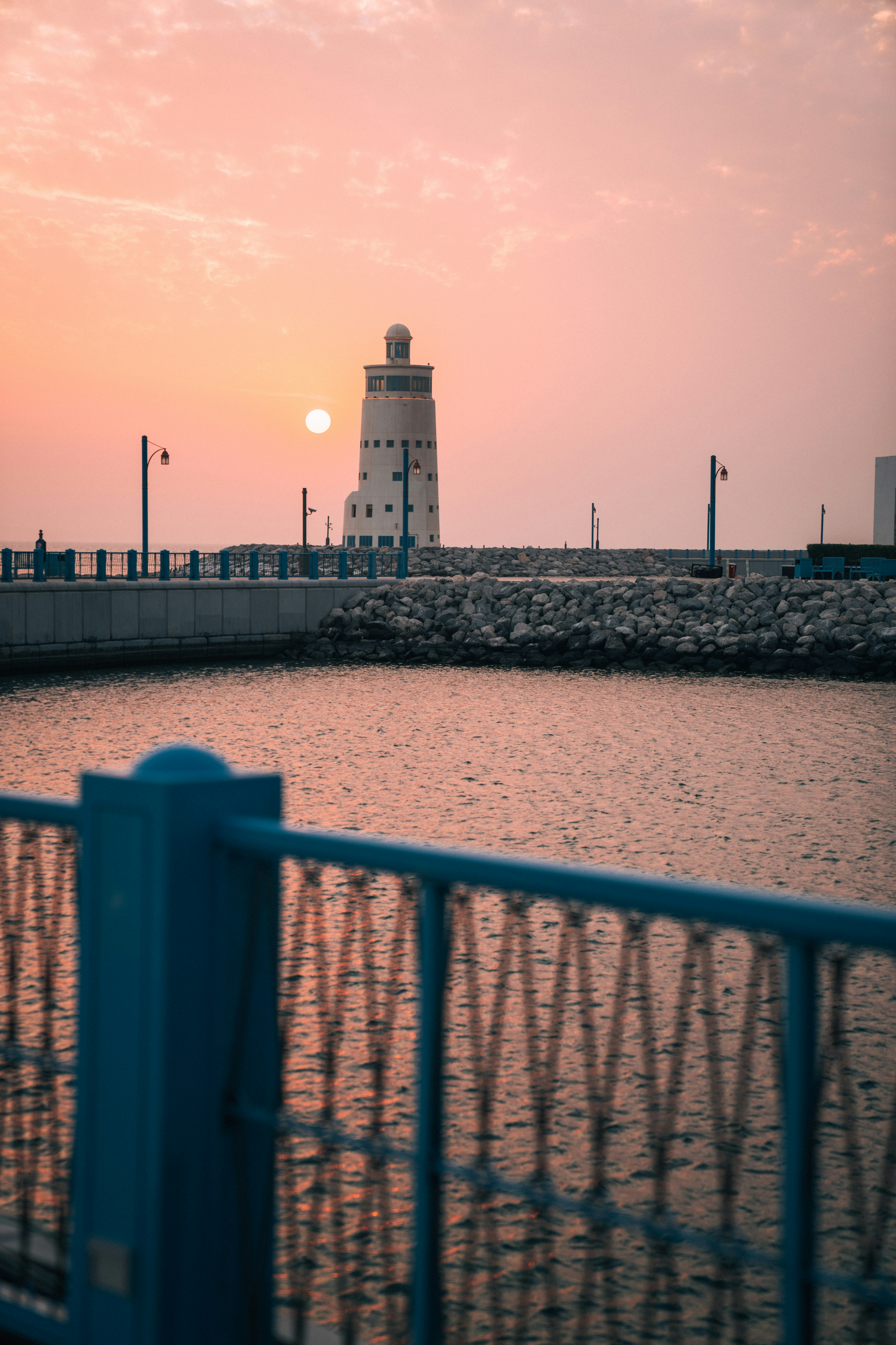 a light house sitting on top of a body of water