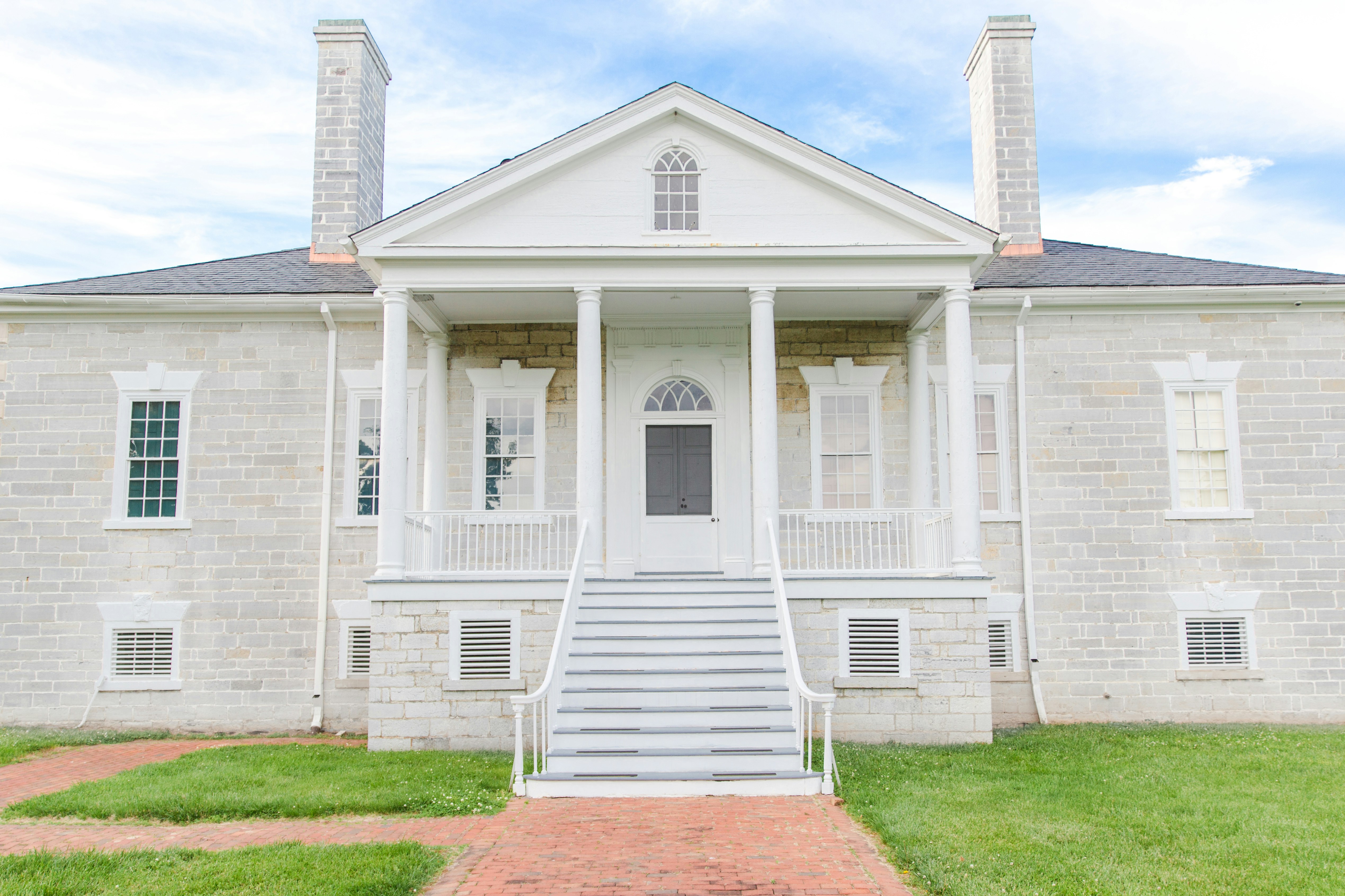 Symmetrical Colonial Facade: Front Porch and Steps to a Central Door