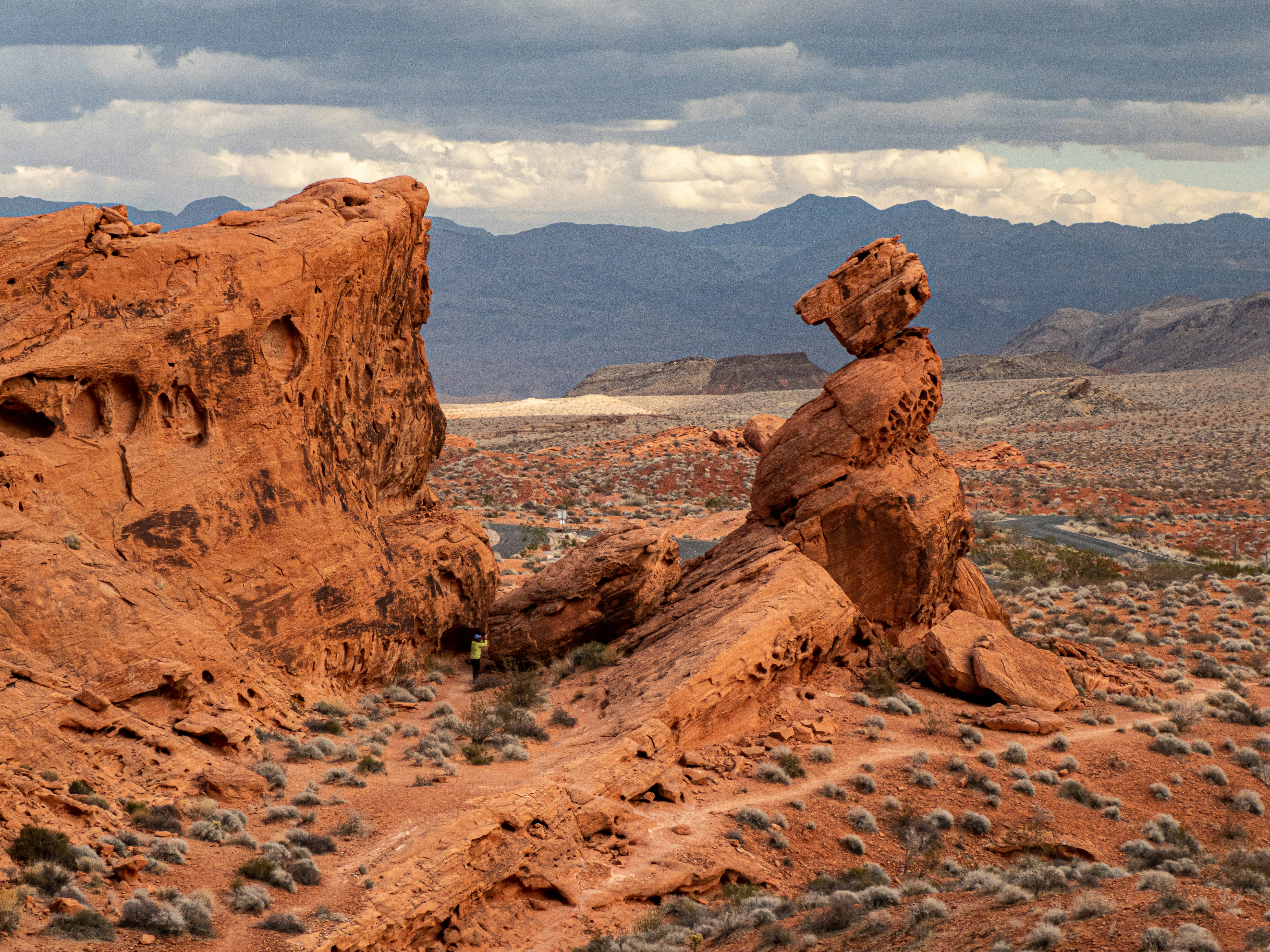 Balanced Desert Sentinel: An Eroded Rock Visage Over a Windswept Basin