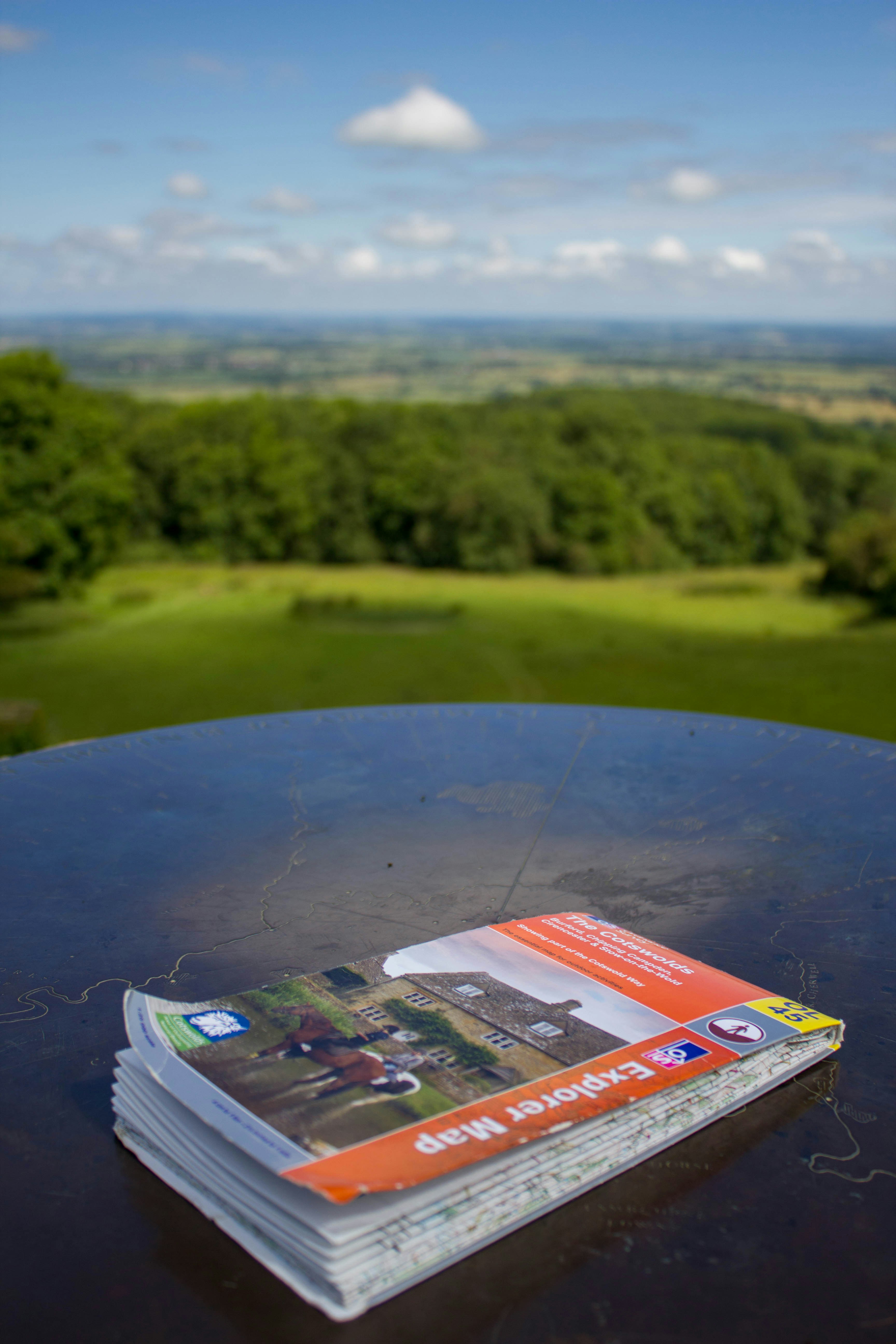 A stack of magazines sitting on top of a table photo – Free Outdoors ...
