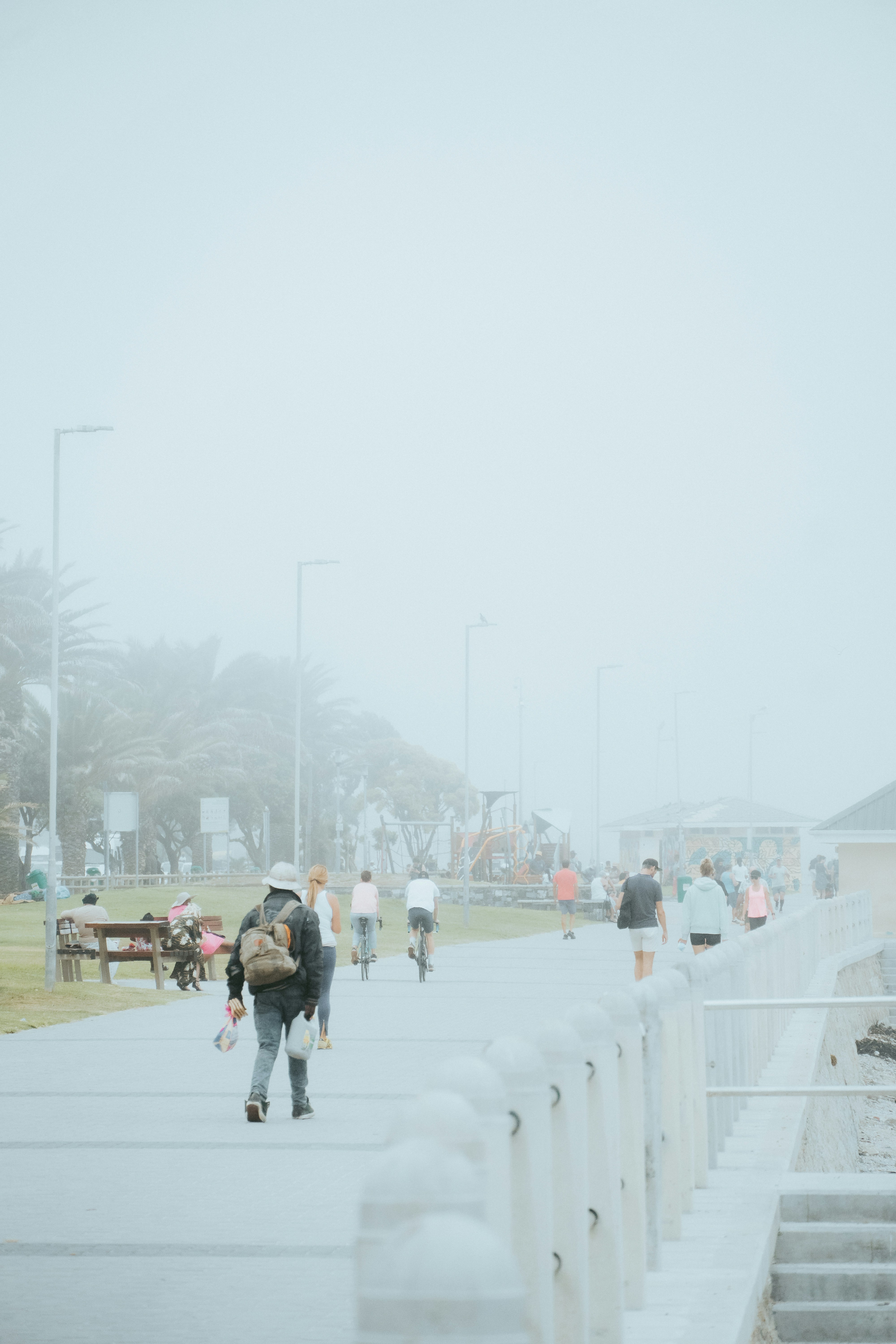 Mist-Softened Promenade: Quiet Morning Along a Foggy Seaside
