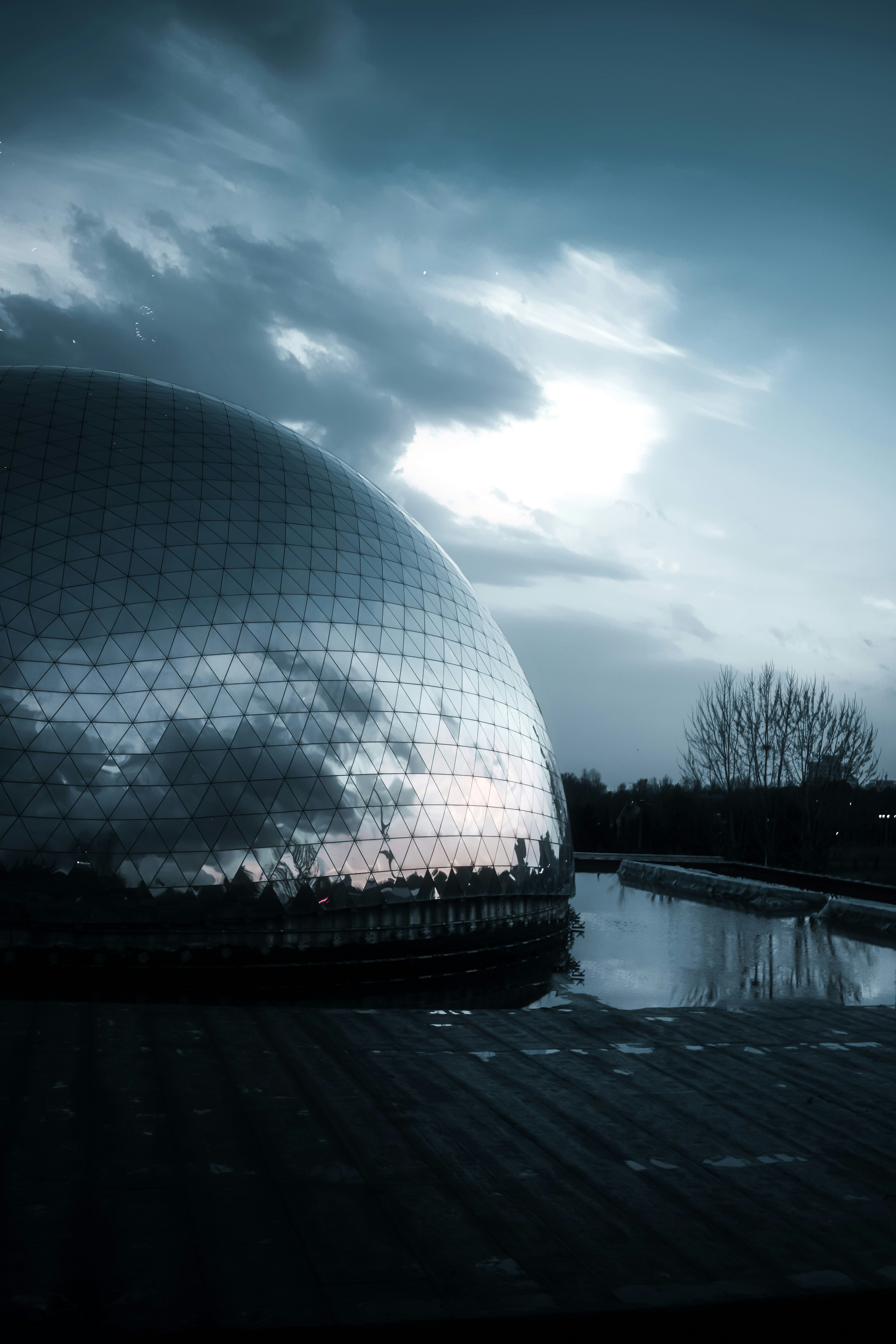 Glass Hemisphere at Dusk: Reflections and Quiet Geometry