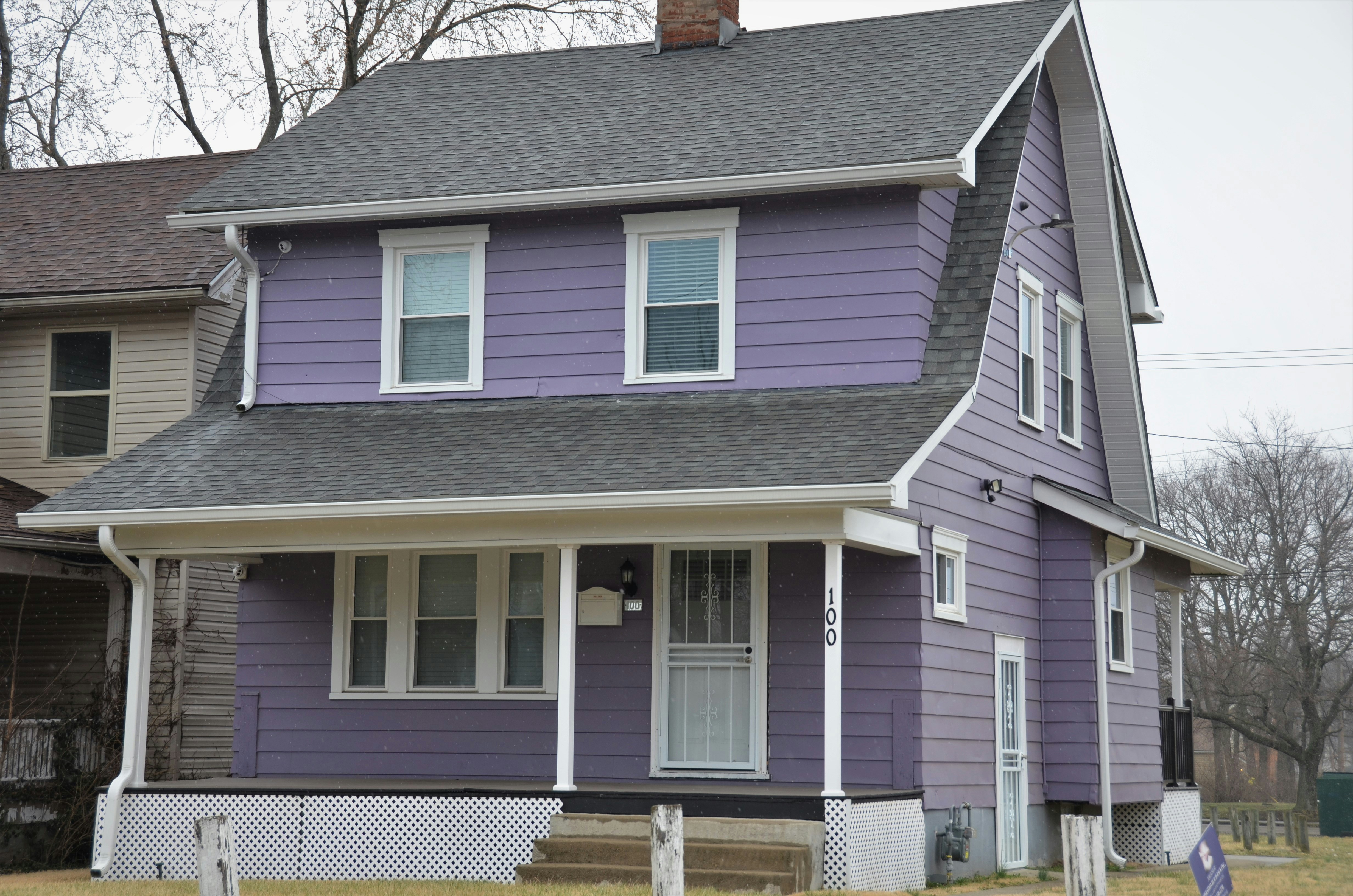 A purple house with a white picket fence photo – Free Siding Image on ...